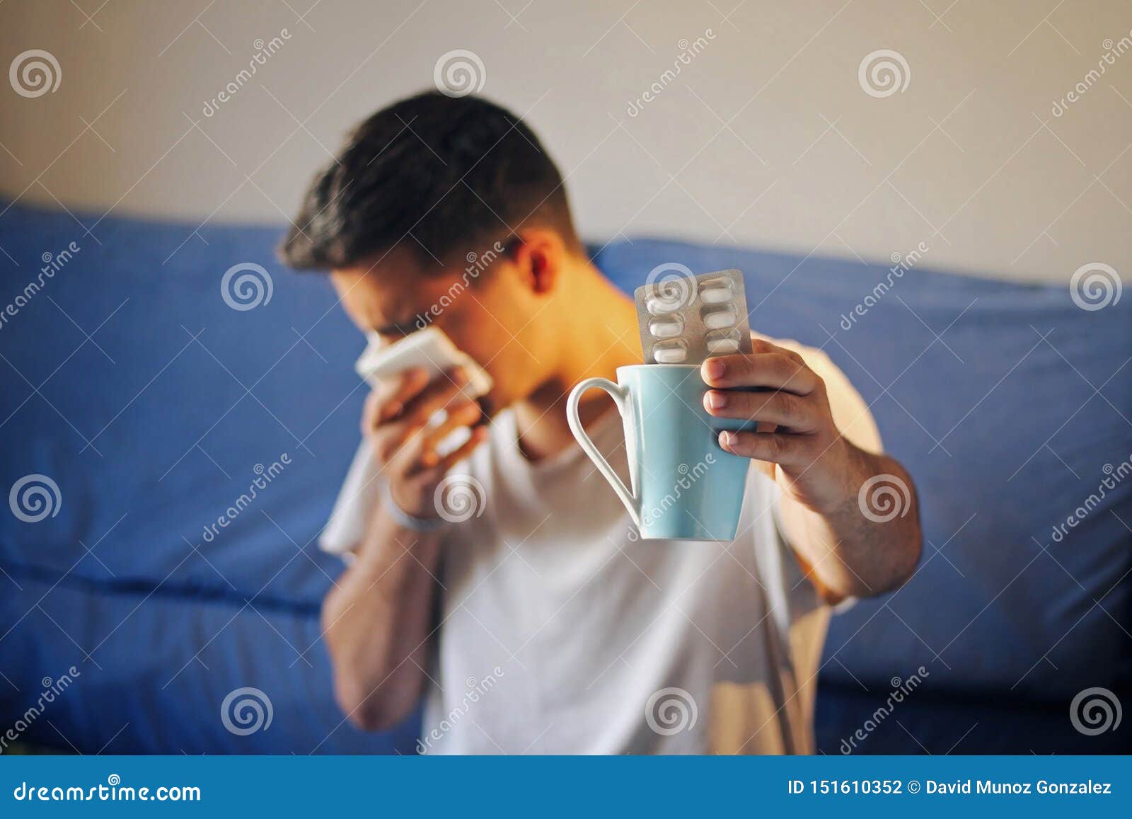 Cold man with meds. stock photo. Image of medicine, couch - 151610352