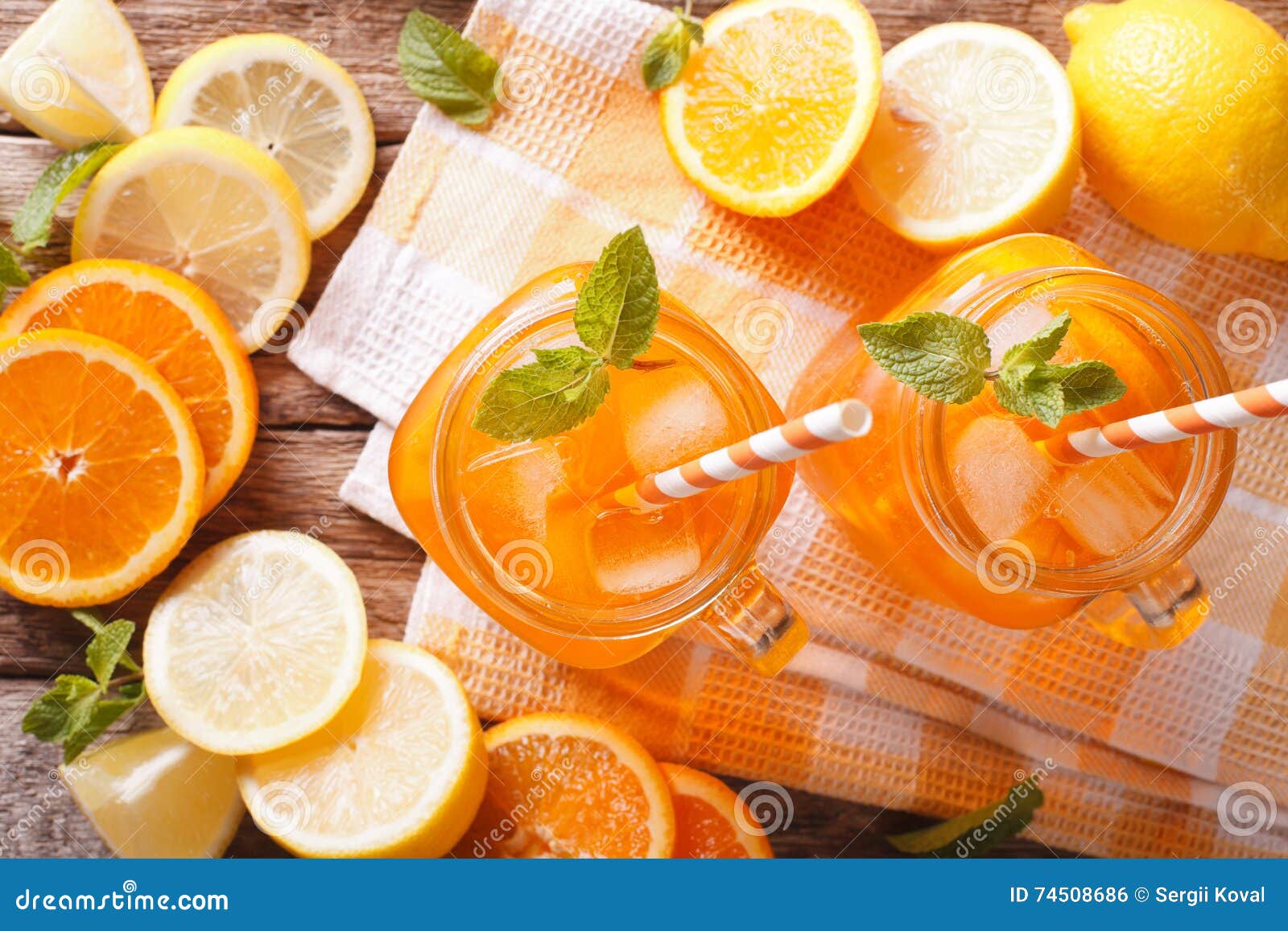 Cold Orange Drink with Lemon, Mint and Ice Close-up. Horizontal Stock ...