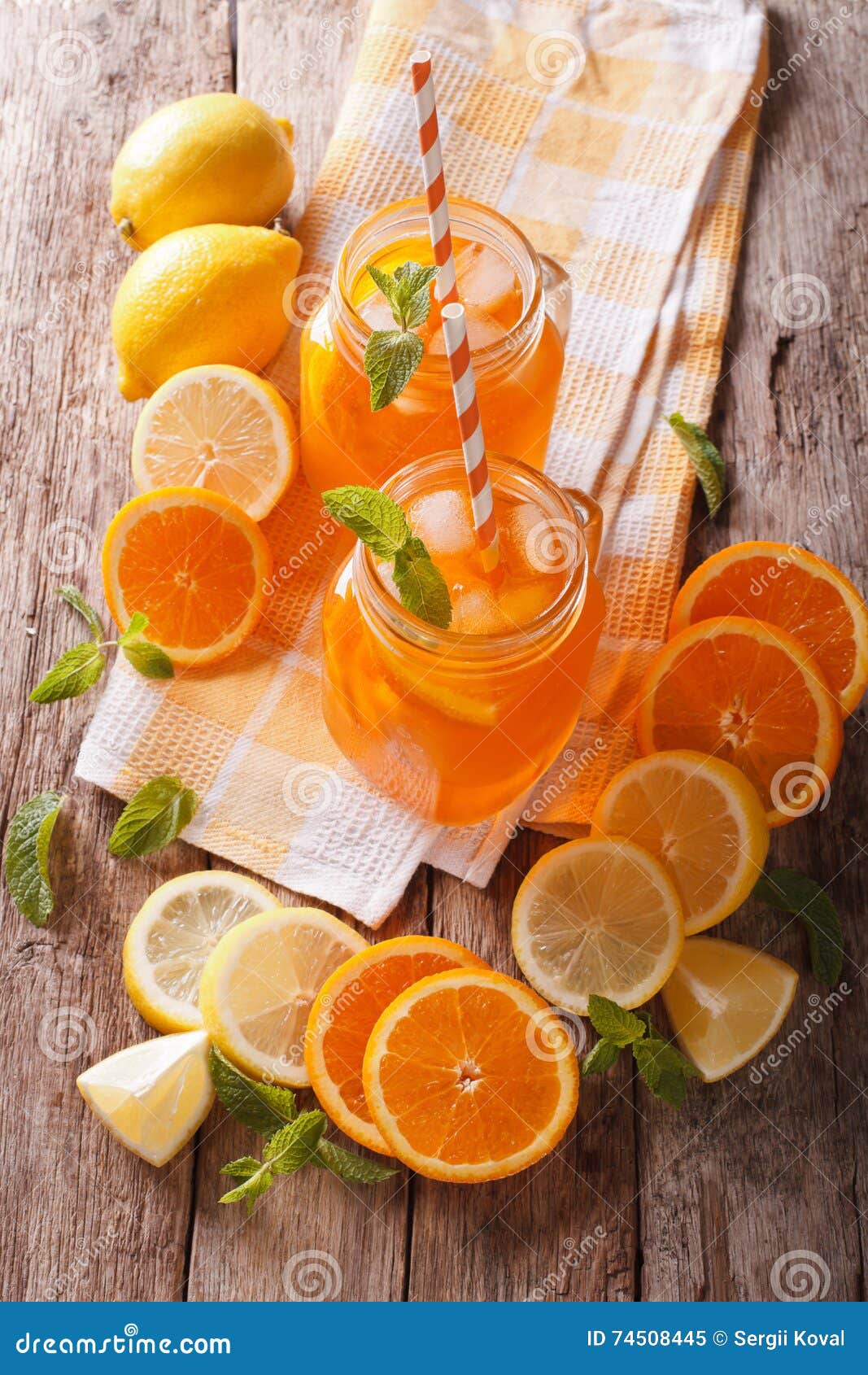 Cold Orange Drink with Lemon, Mint and Ice Close-up. Vertical To Stock ...