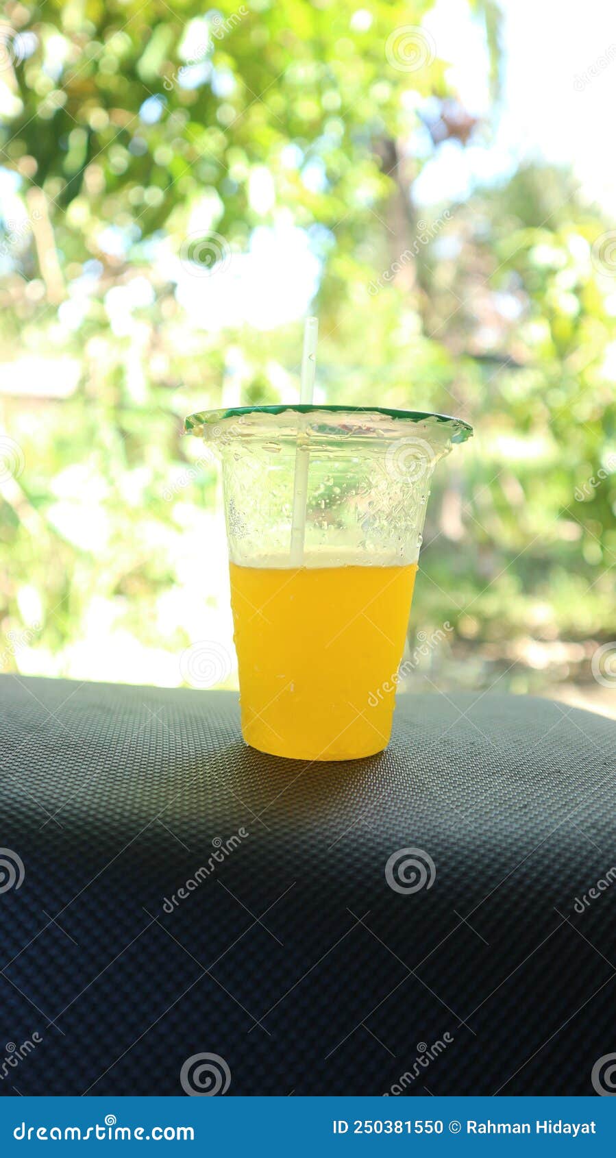 Cold Orange Iced Plastic Cup Drink that is Very Fresh To Drink Stock ...
