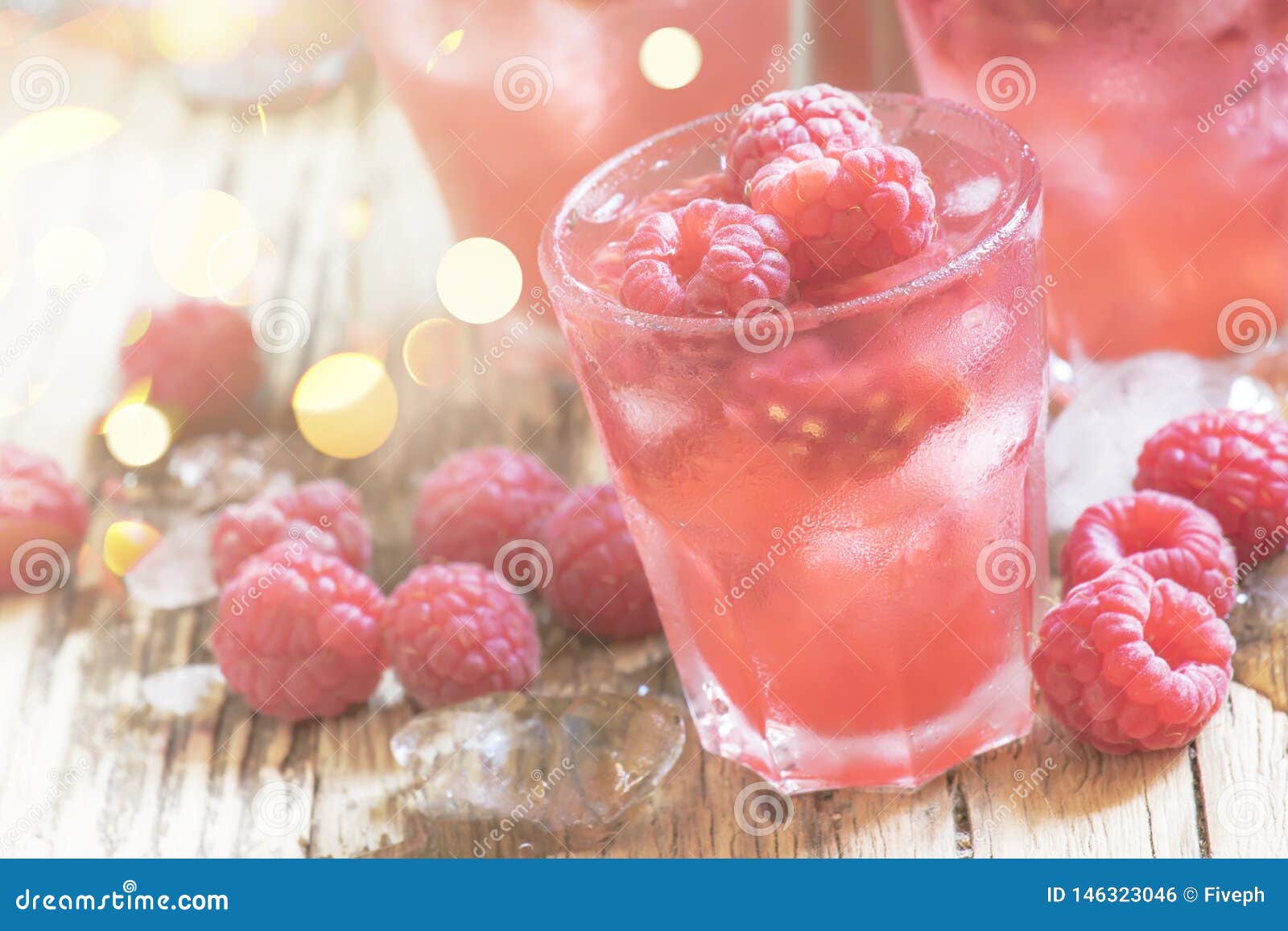 Cold Raspberry Cocktail with Ice, Pink Summer Berry Beverage, Selective ...