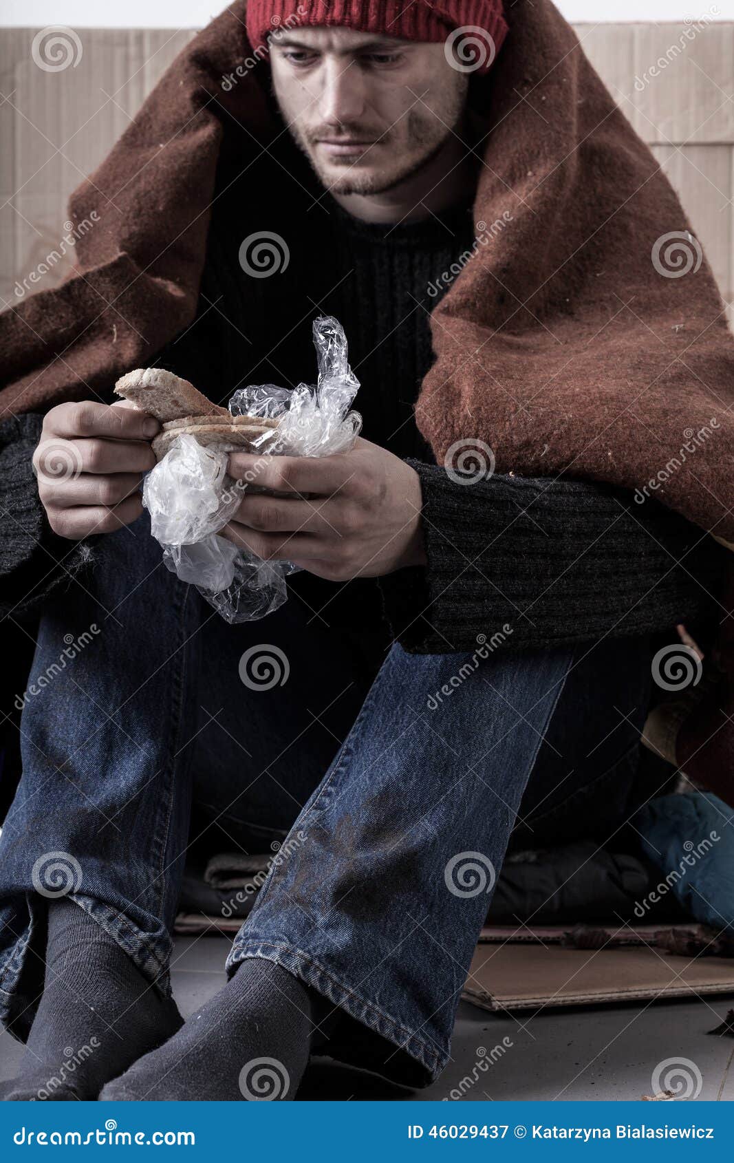 Cold and Sad Homeless Man is Eating a Bread Stock Image - Image of ...