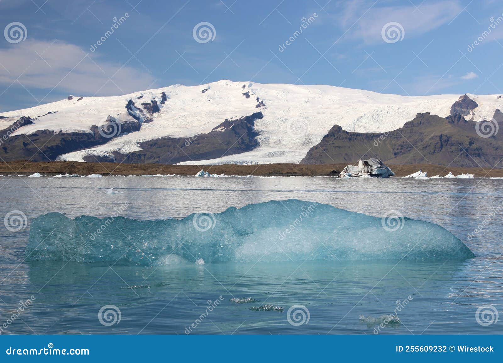 Cold Scene of Ice on the Water with Snowy Hills on the Background Stock ...