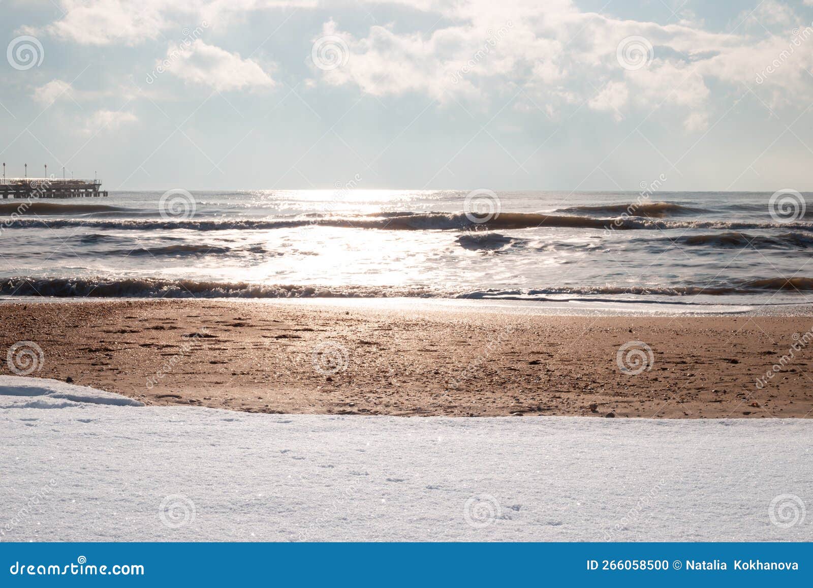 Cold Sea with a Pier and Snow on the Sandy Shore. Black Sea in Winter ...