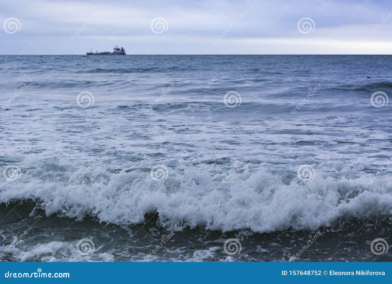 Cold Sea and Ship on the Horizon. the Sea in Bad Weather Stock Photo ...