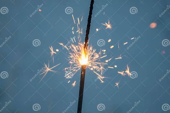 Cold Sparklers on a Blue Background Stock Photo - Image of closeup ...