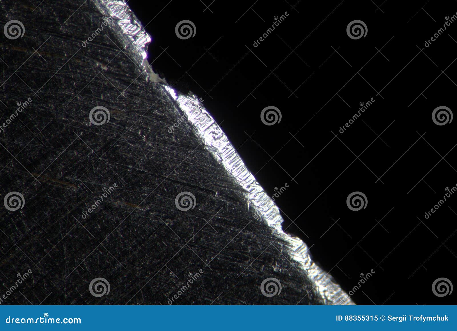 Cold Steel Razor Blade by Microscope. Microscopic Scratched Steel ...