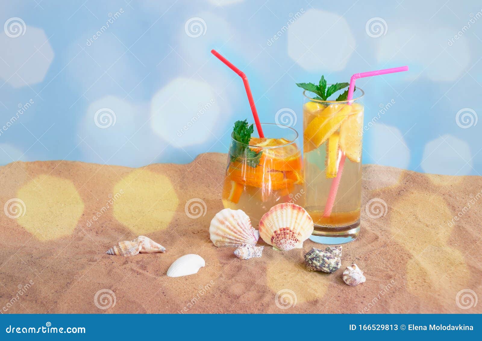 Cold Summer Drinks with Lemon and Orange on Sand Beach. Seashells Near ...