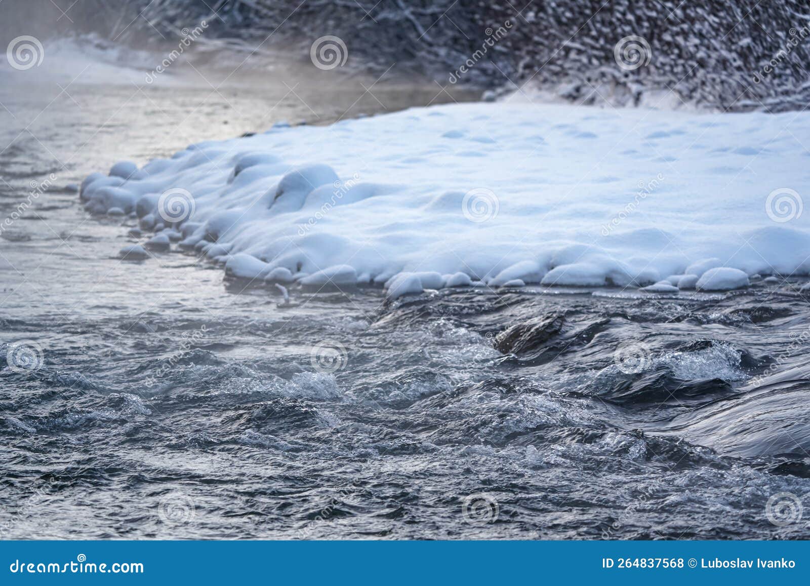 Cold Winter River, Steam Visible Above Water, Dark Trees on Side Stock ...