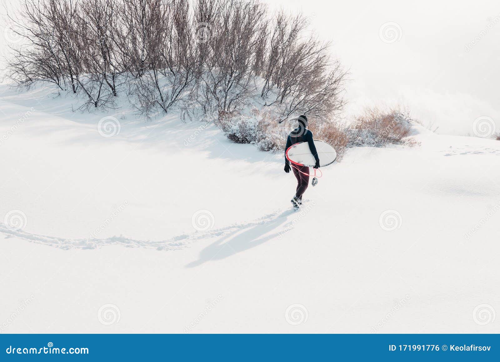 Cold Winter and Surfer with Surfboard. Snowy Day with Surfer in Wetsuit ...