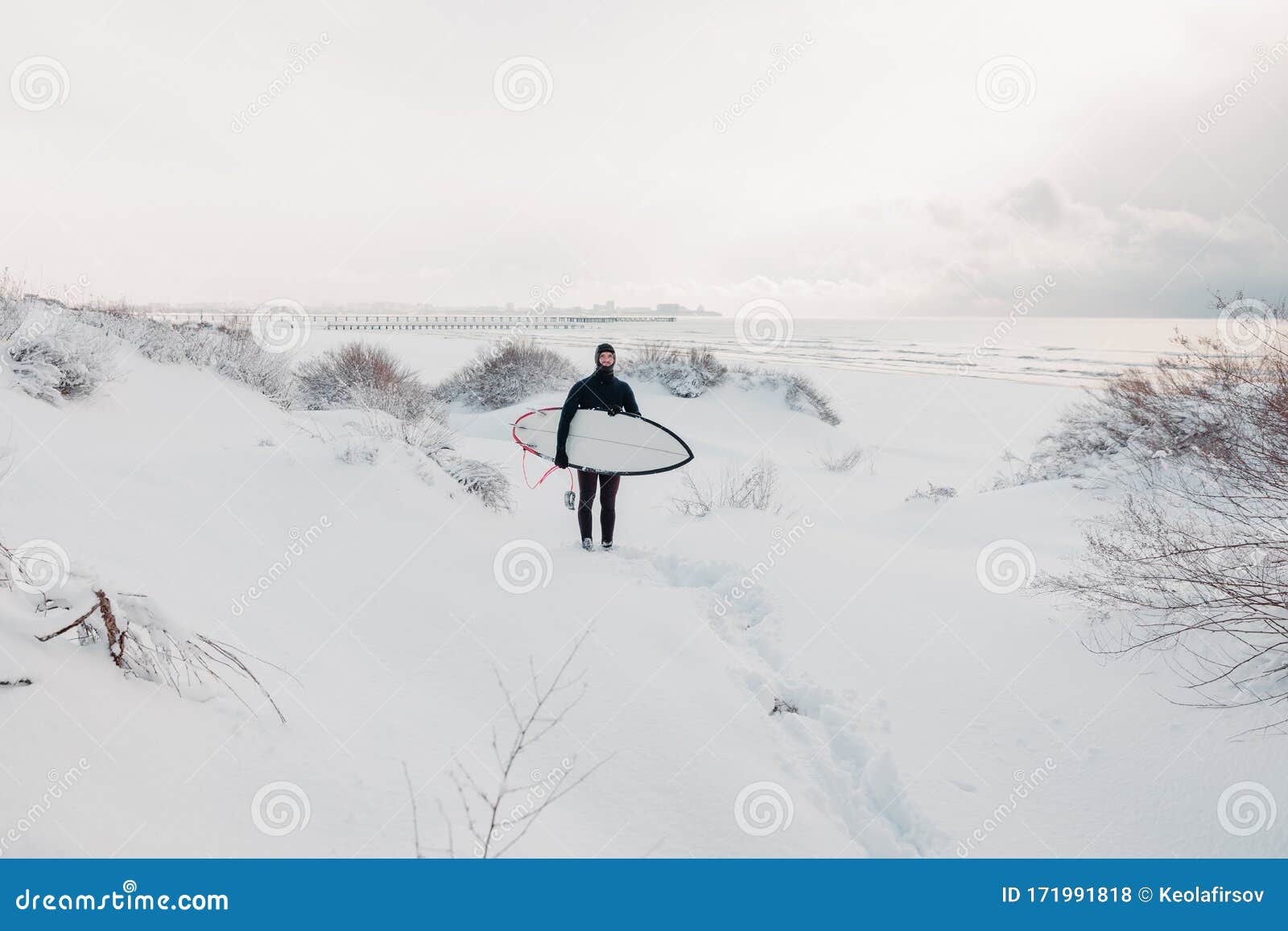 Cold Winter and Surfer with Surfboard. Snowy Day with Surfer in Wetsuit ...
