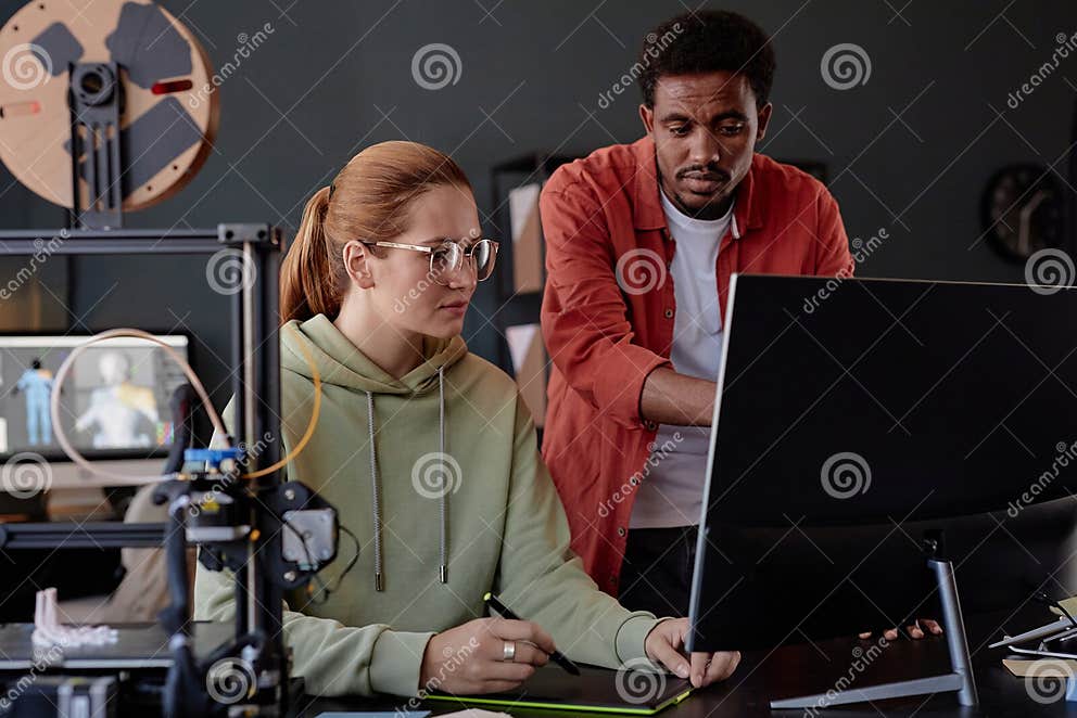 Collaborating on 3D Printing Project in Modern Workspace Stock Photo - Image of focused, desktop ...
