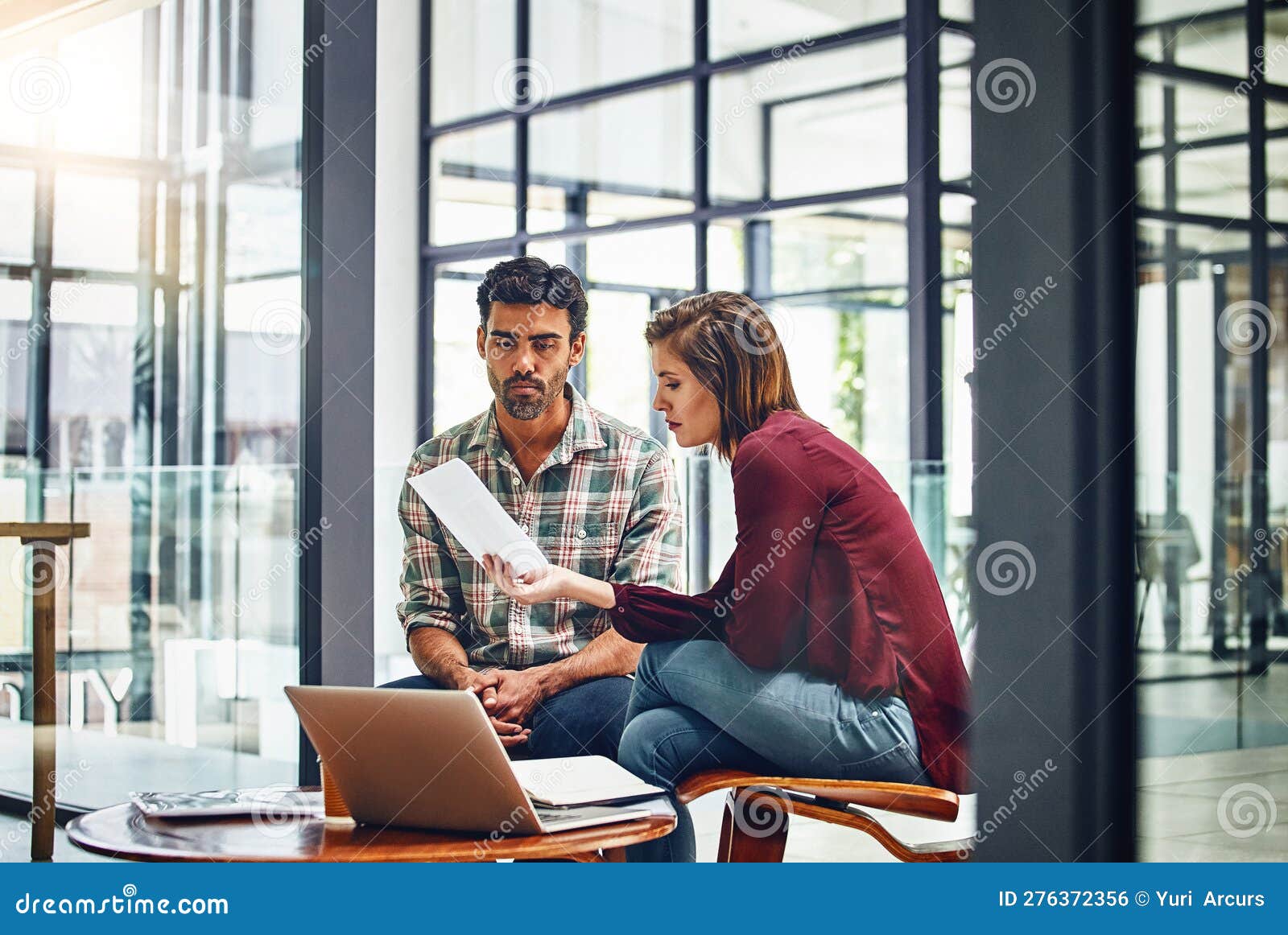 Collaborating on a Design. Two Young Designers Working Together in ...