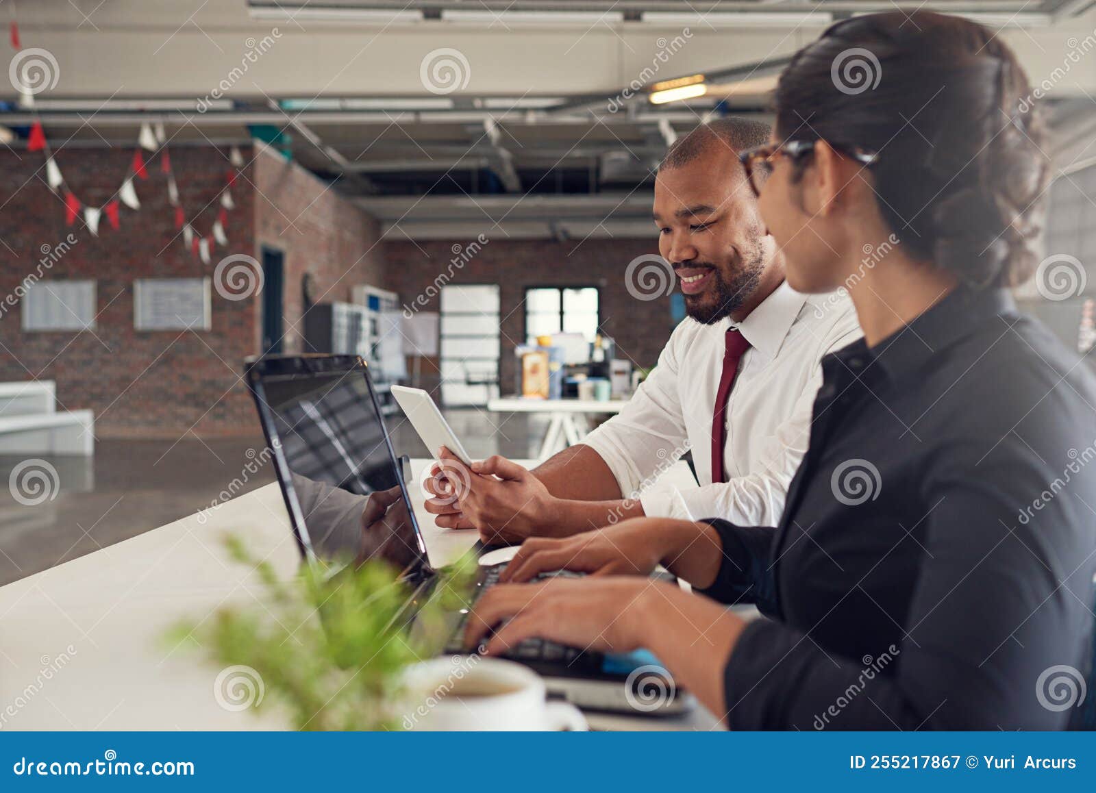 Collaborating on a New Design. Two Colleagues Working Together in the ...