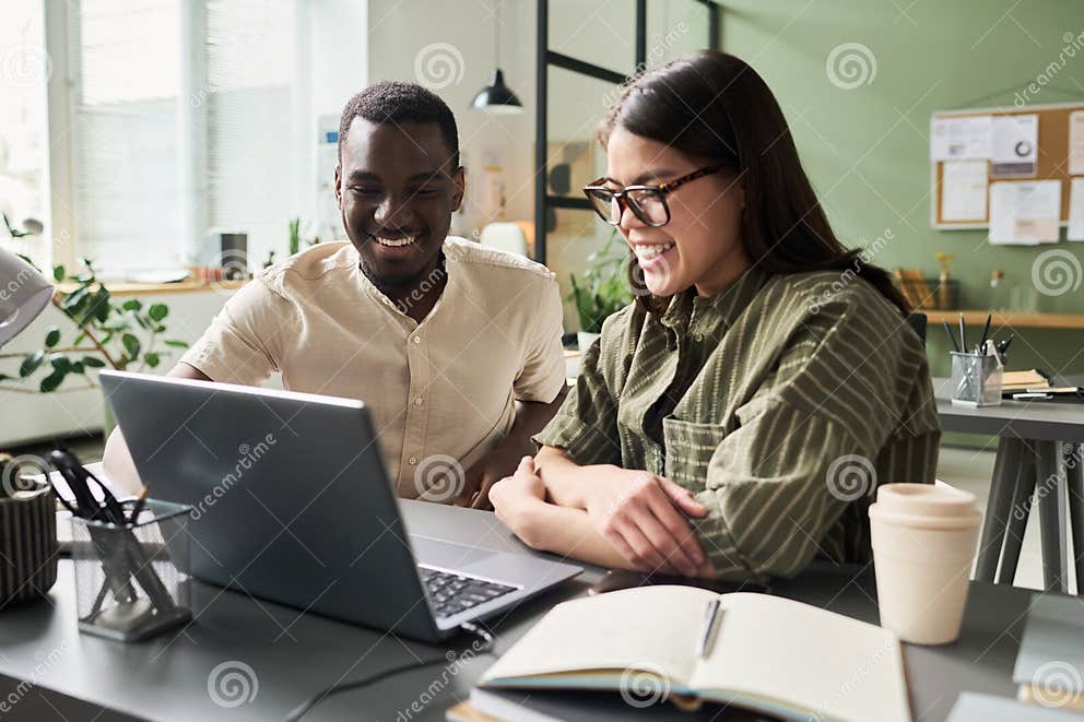 Collaborating and Smiling during Office Work Stock Image - Image of ...