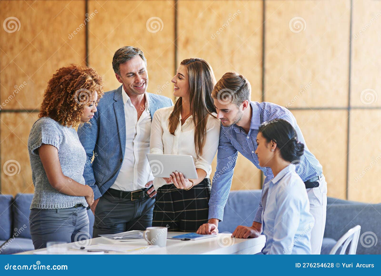 Collaboration in Action. a Group of Colleagues Working Together on a ...