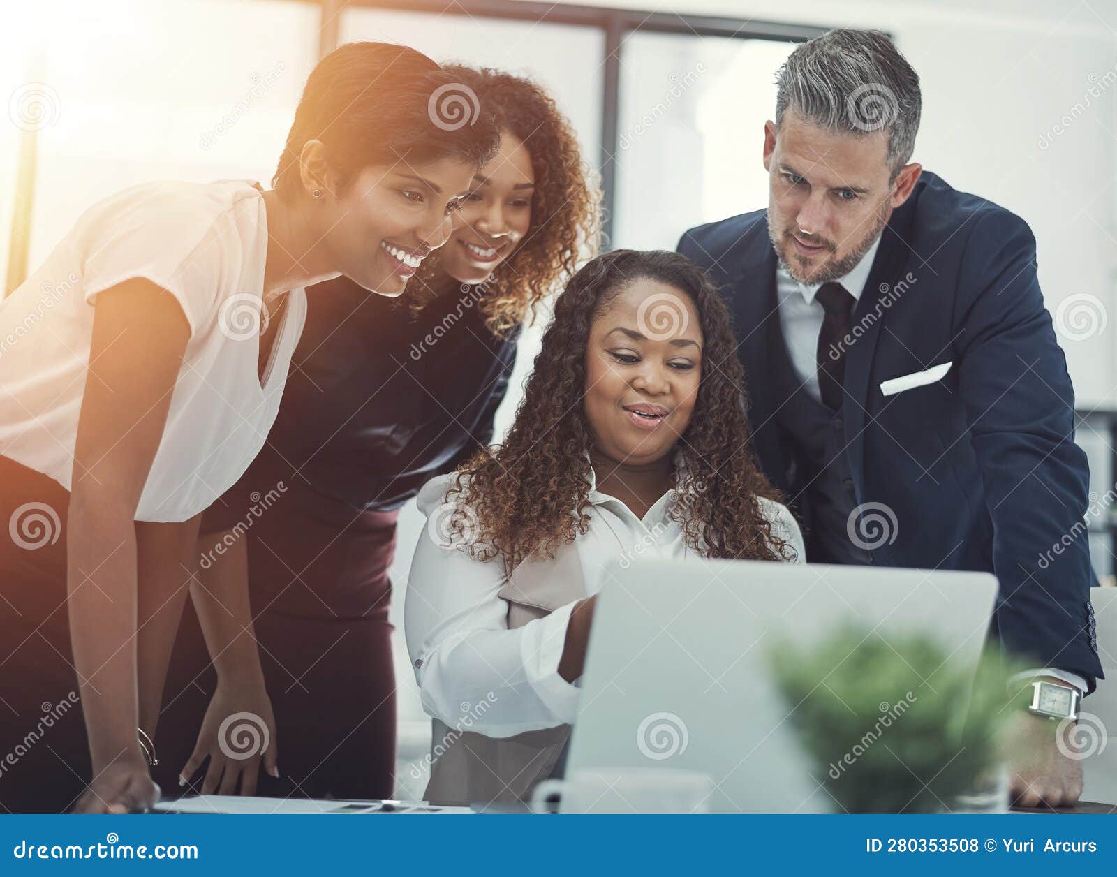 Collaboration Brings Great Results. a Group of Colleagues Using a ...