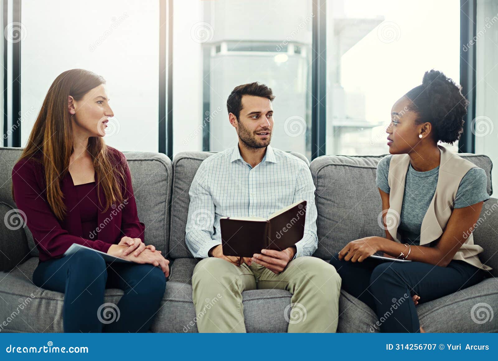 Collaboration, Discussion and Employee with Notebook on Sofa for ...