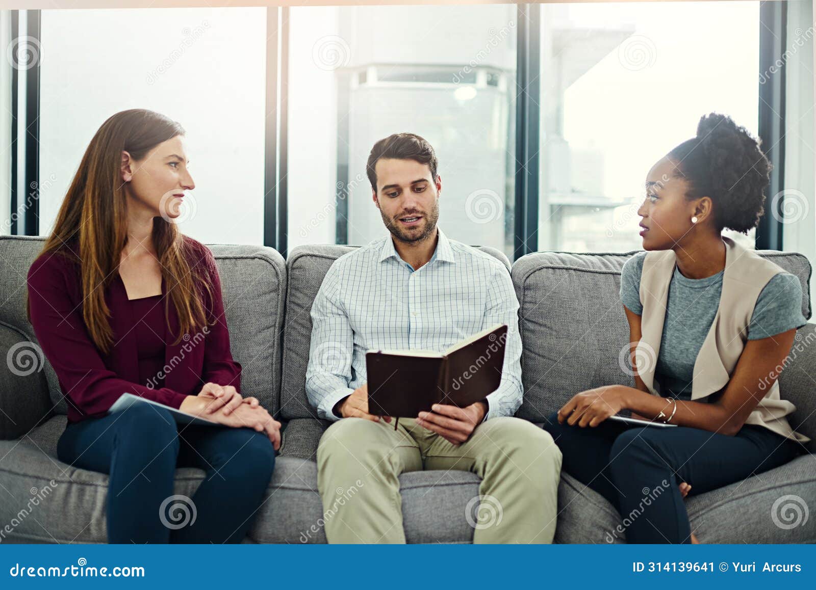 Collaboration, Employee Reading and Notebook on Sofa for Information ...