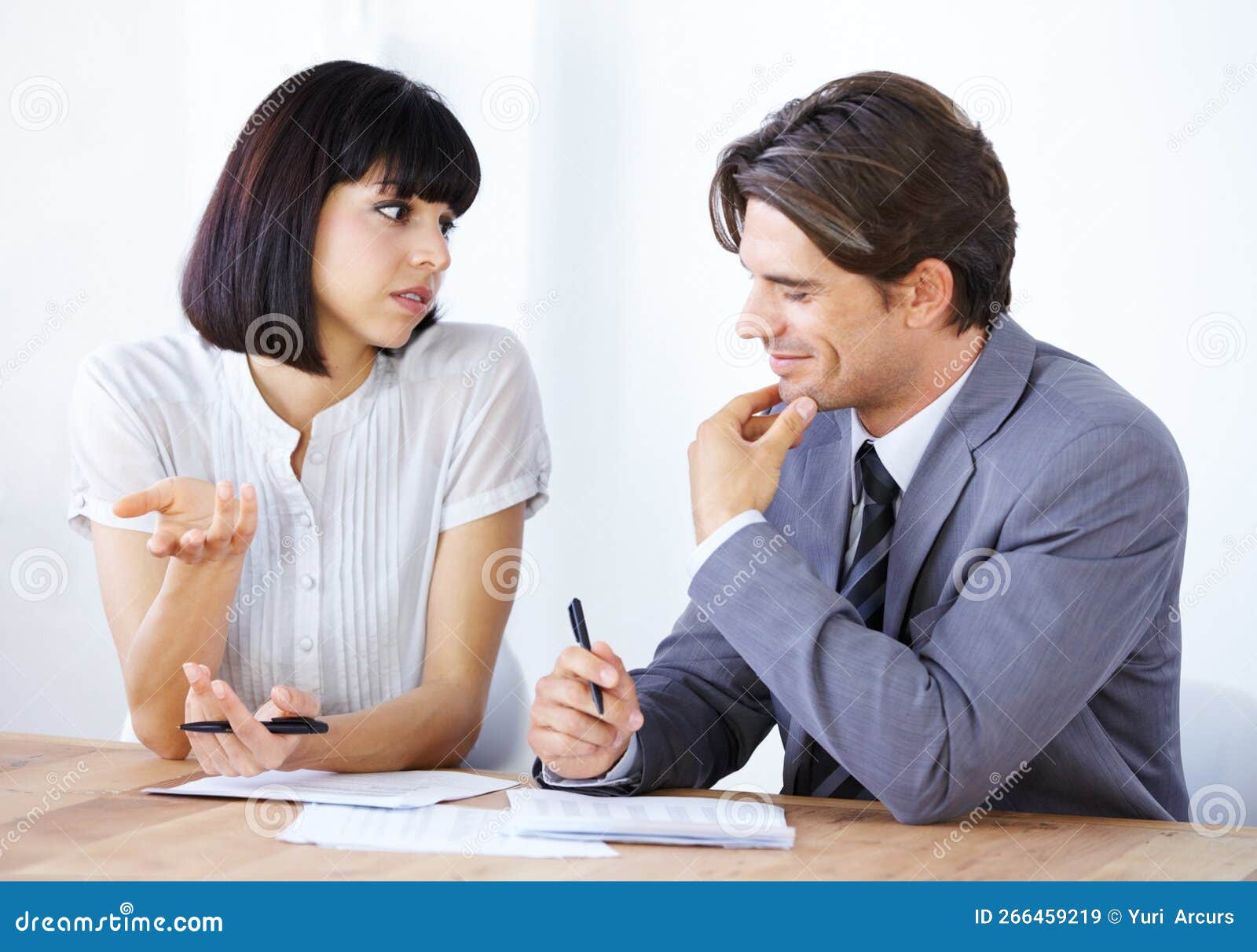 Collaboration in the Office. Two Young Executives Going Over a Project ...