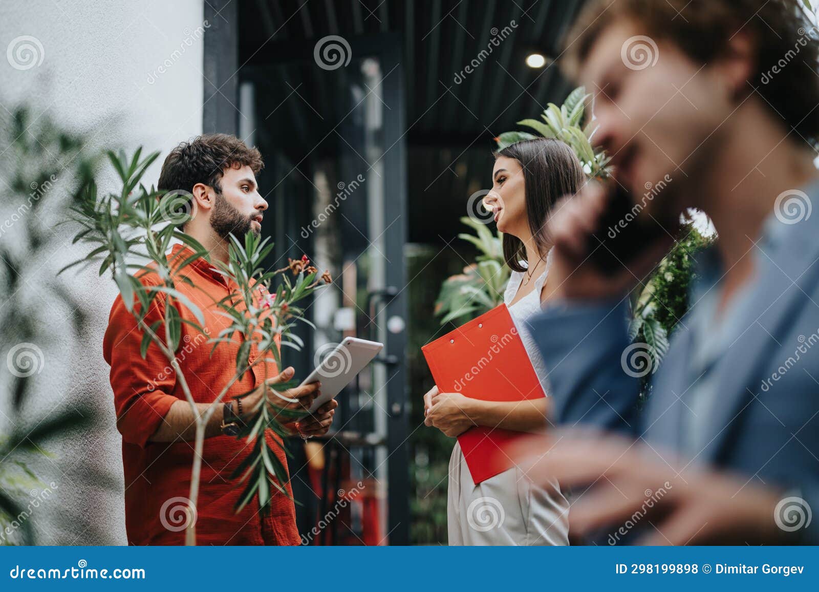 Collaborative Architects Discussing Blueprint at Construction Site ...