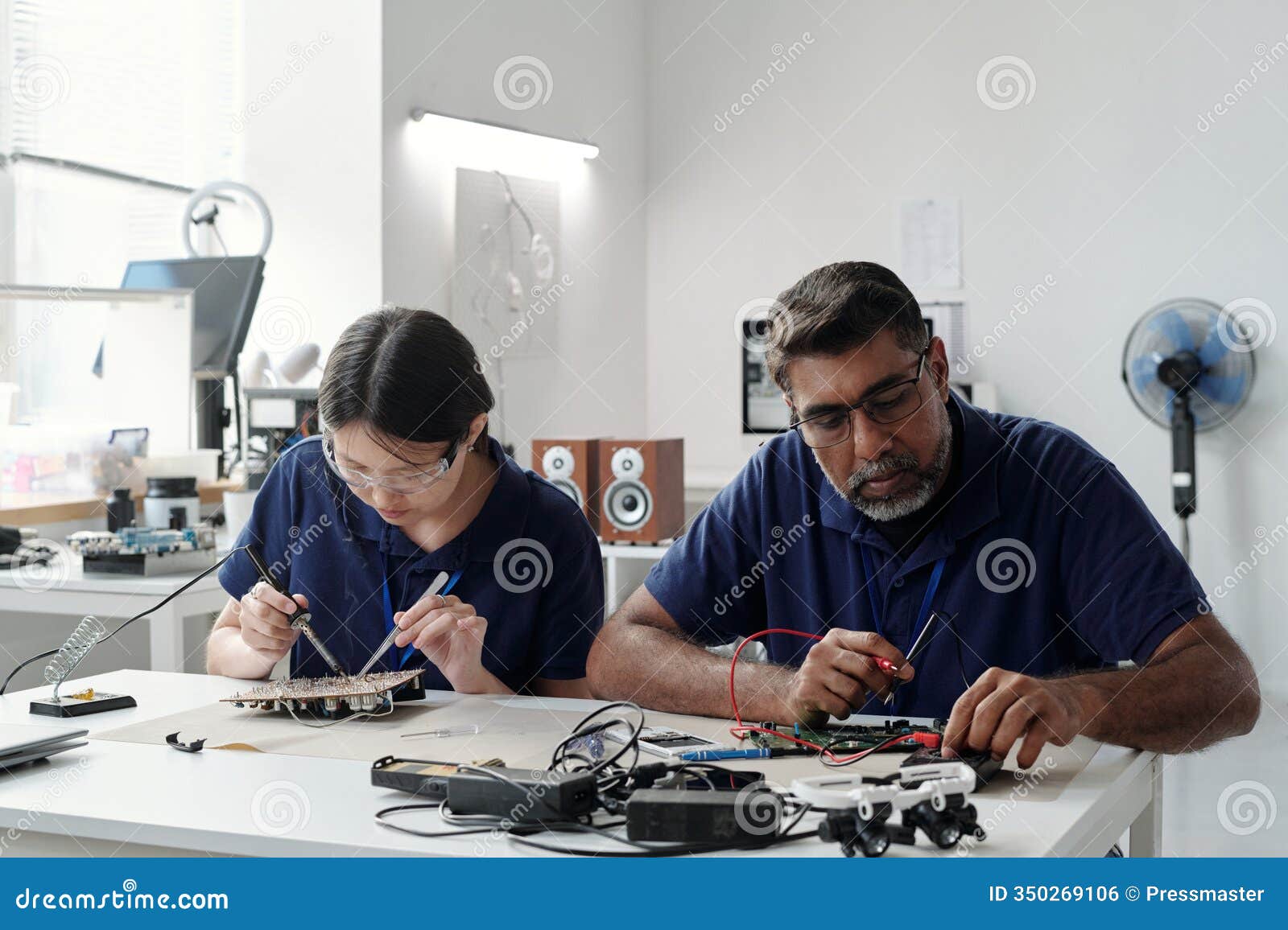 Collaborative Engineers Working on Circuit Boards in Lab Stock Photo ...