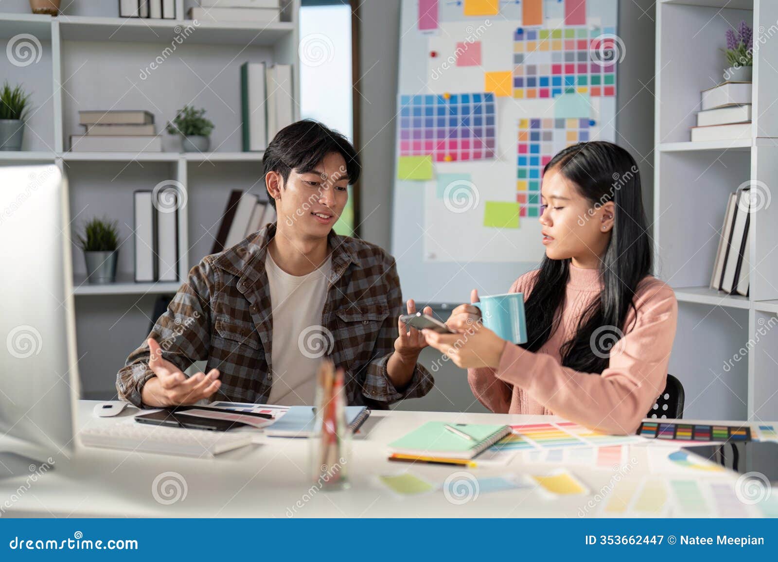 Design Team Meeting on Color Chart Graphics in a Creative Workspace ...