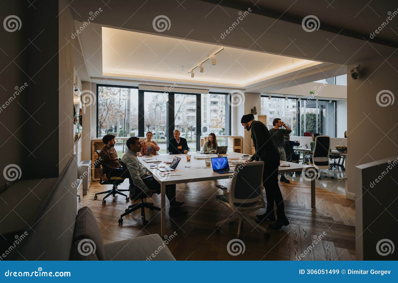 Collaborative Team in a Well-lit Office Engaging in a Business Meeting ...
