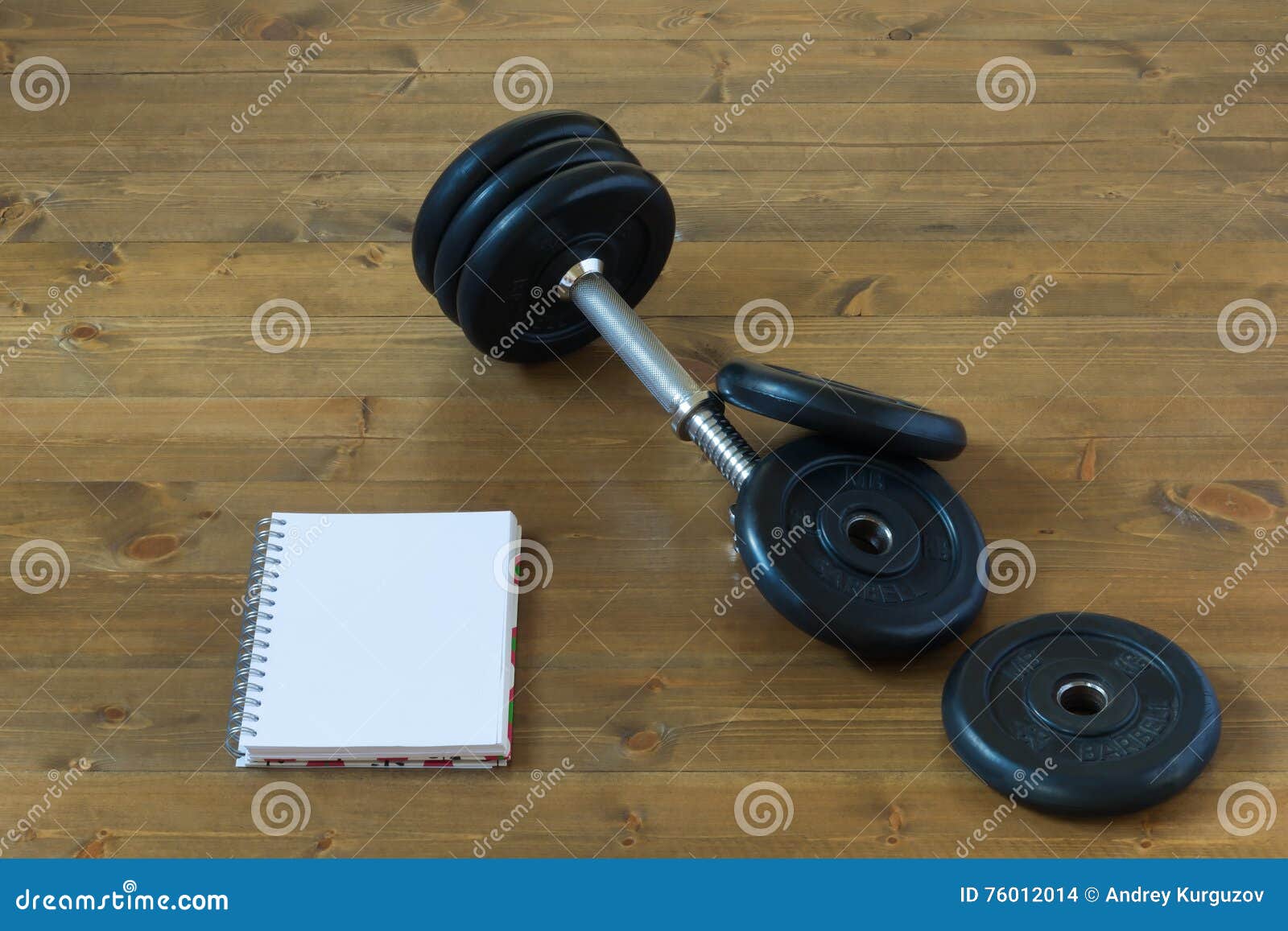 Collapsible Dumbbells on a Table with a Sheet of Paper Stock Photo ...