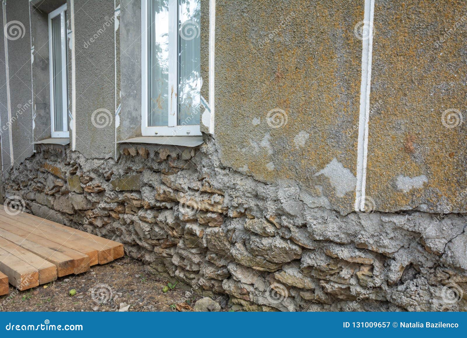 Old Damaged Wall of a Saber House with a Collapsing Base of the House ...