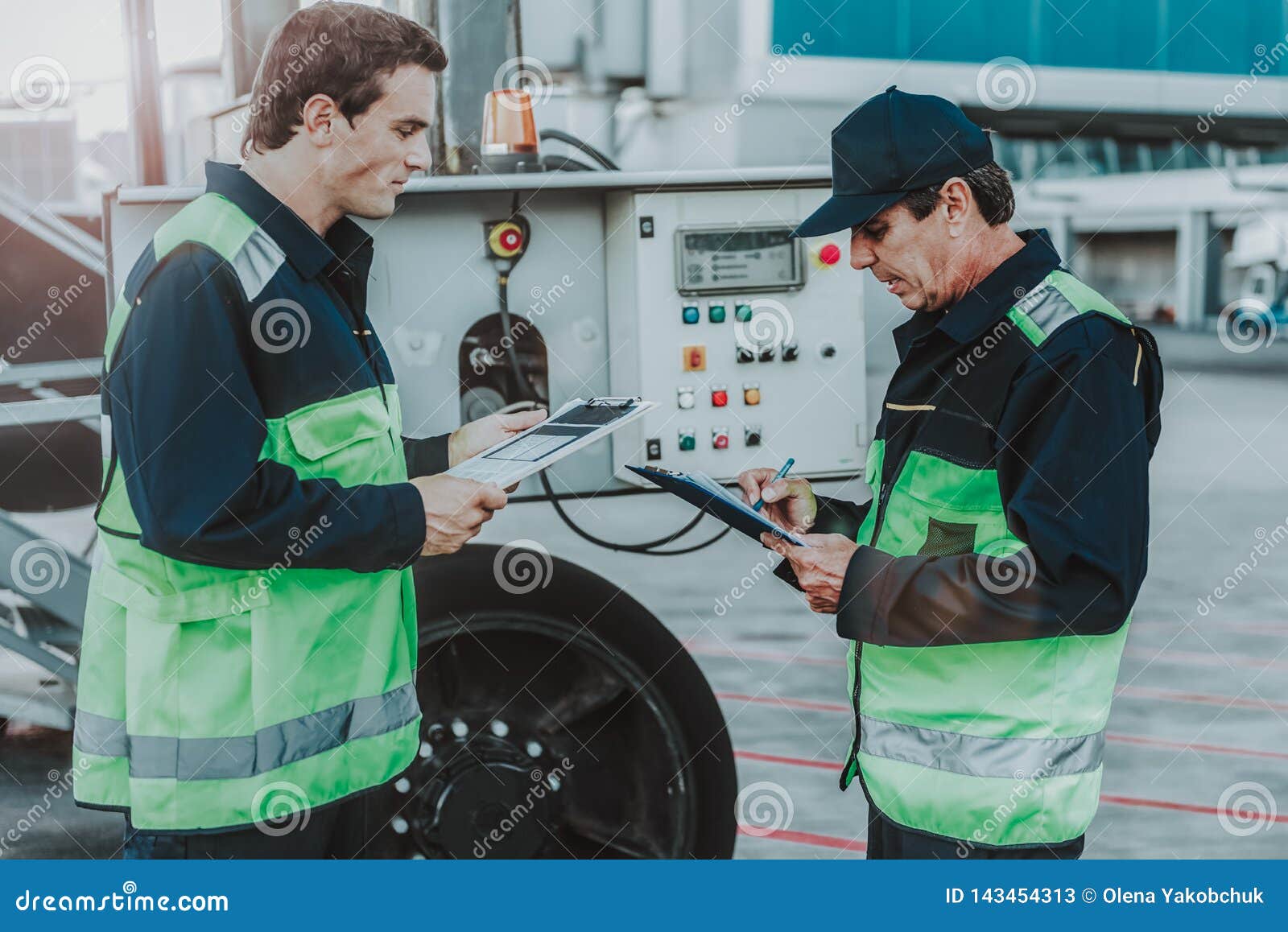 Engineers In Uniform Coveralls Stand With Tools Instruments Posing ...