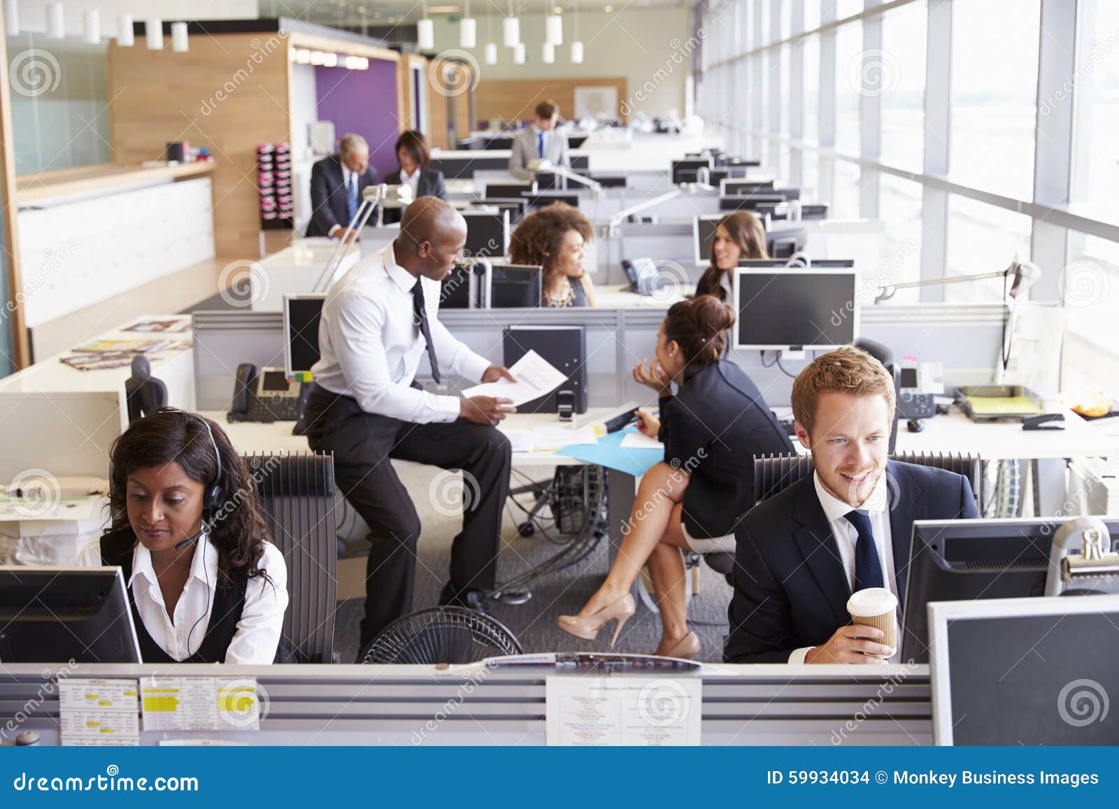 Colleagues Busy Working at Desks in an Open Plan Office Stock Photo ...