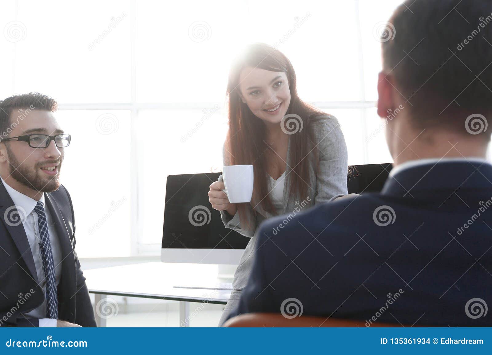 Colleagues Chatting while Enjoying Coffee Break in the Office Stock ...