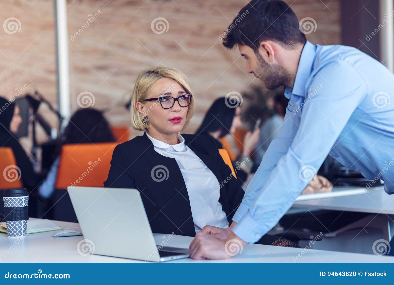 Colleagues Chatting, Sitting Together at Office Table, Smiling Stock ...