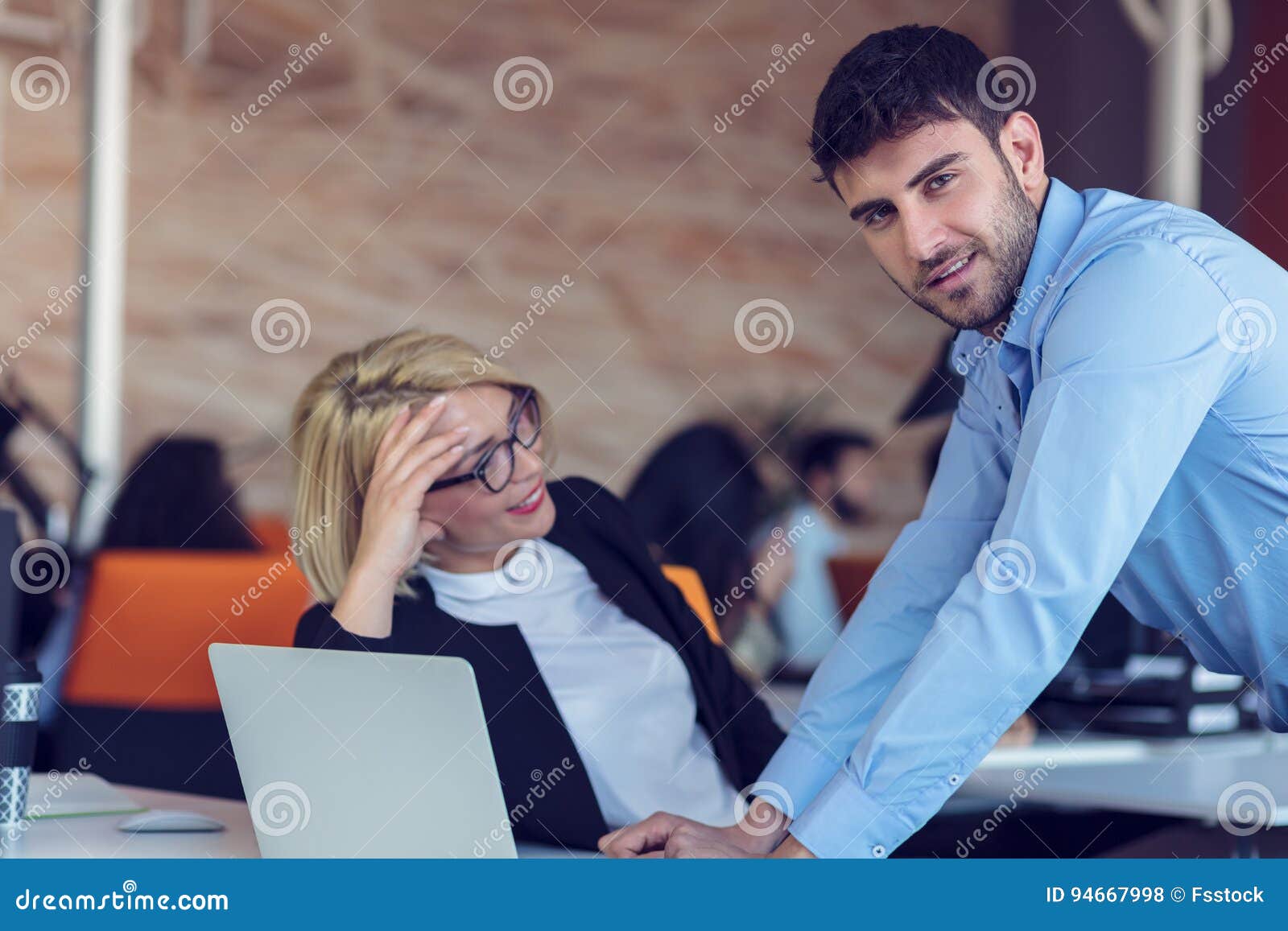 Colleagues Chatting, Sitting Together at Office Table, Smiling Stock ...