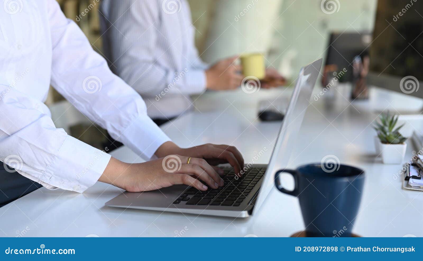 Colleagues Collaborating Working Online Together Using Laptop Computers ...