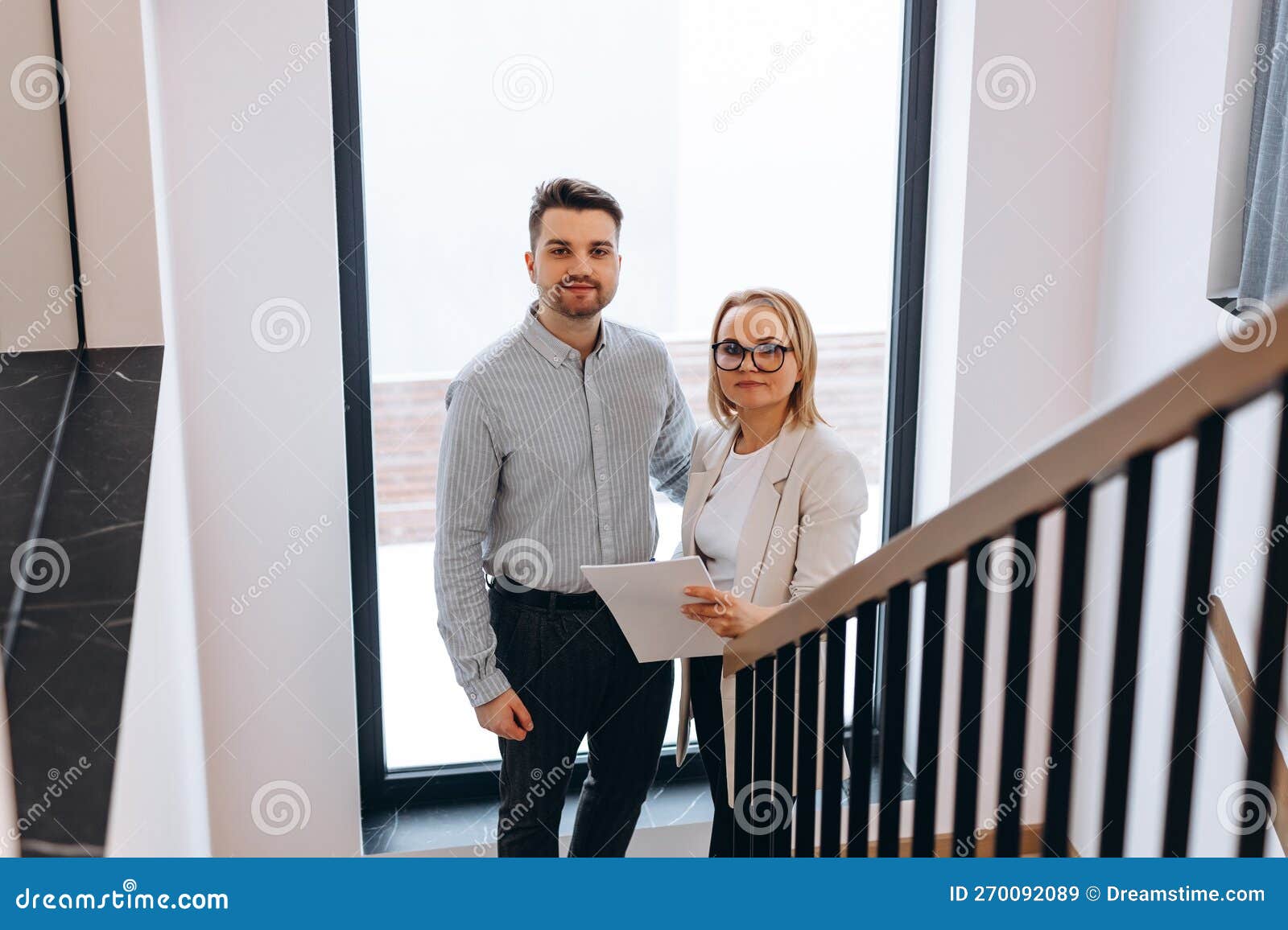 Colleagues Communicating in Modern Office Discussing Sales Work Plan ...