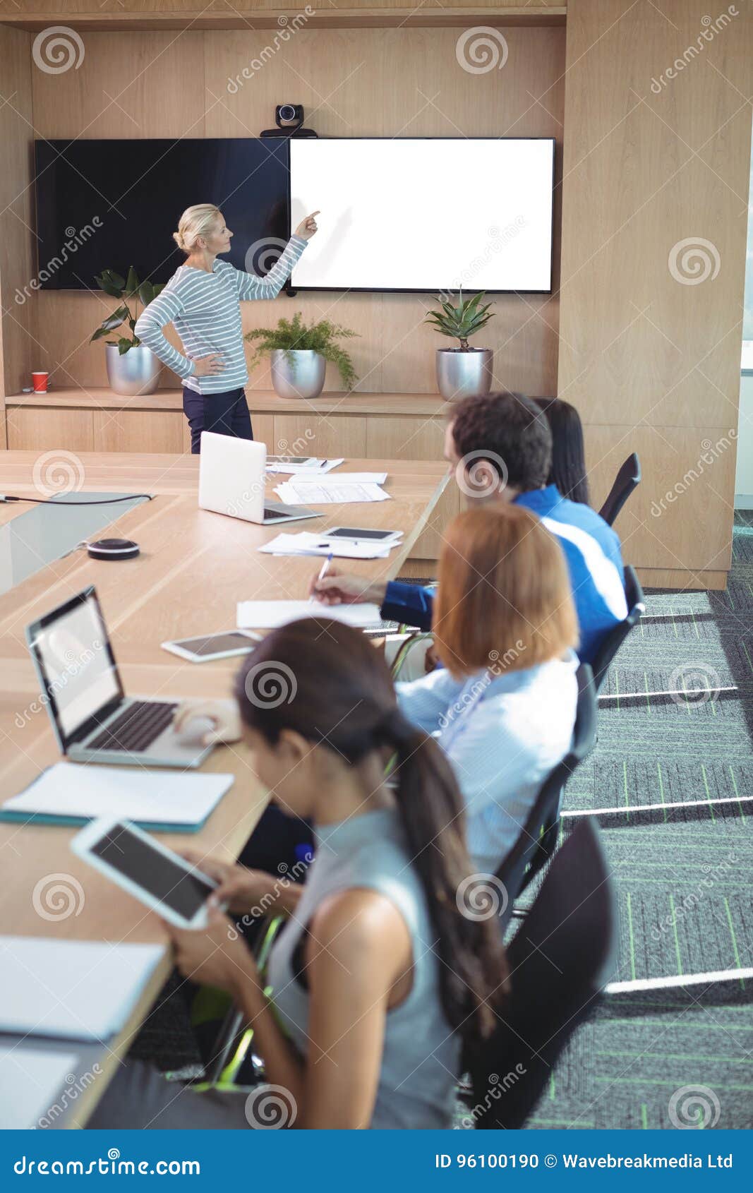 Colleagues at Conference Table during Business Meeting Stock Photo ...