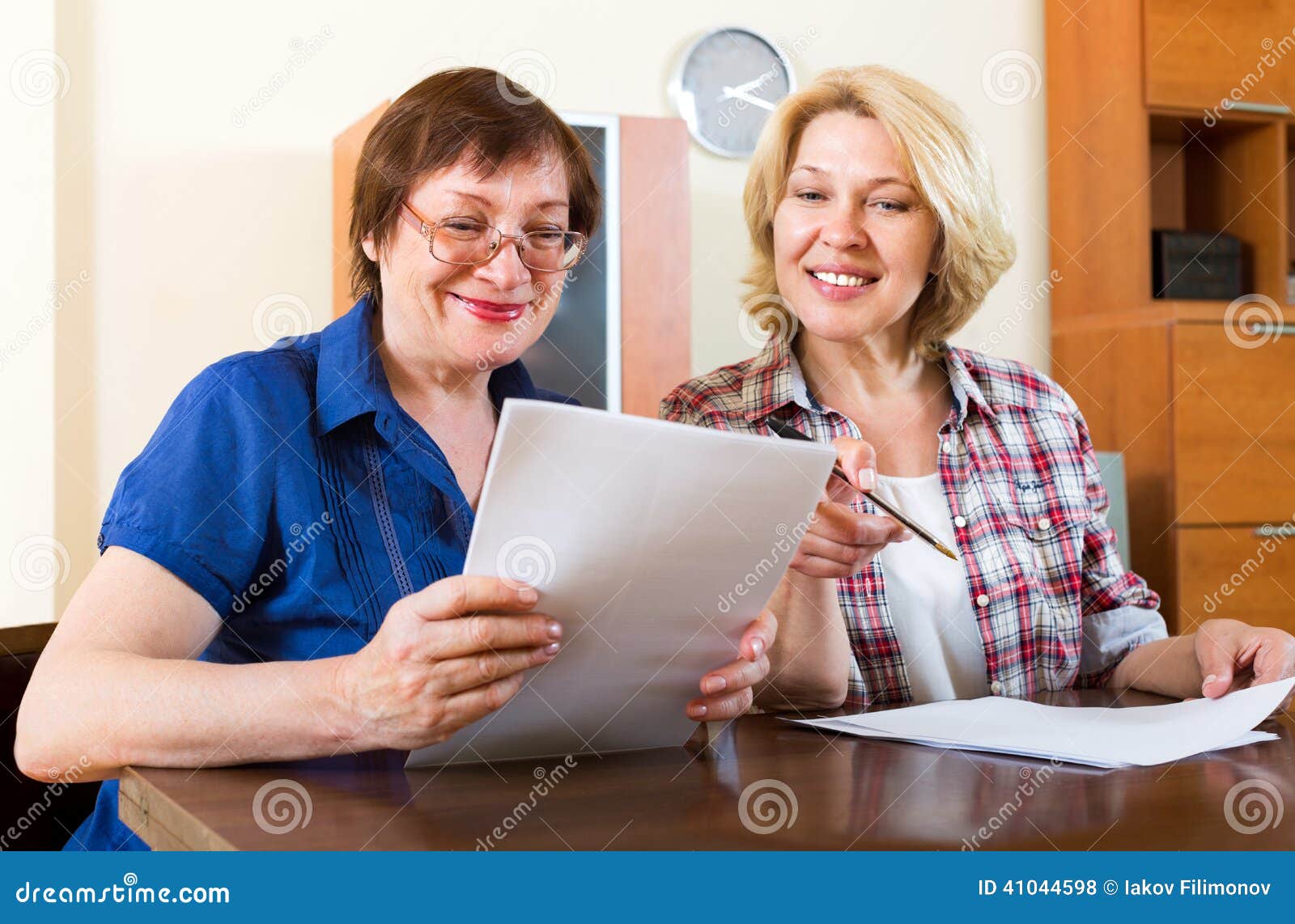 Colleagues Discussing the Contents of the Documents Stock Photo - Image ...