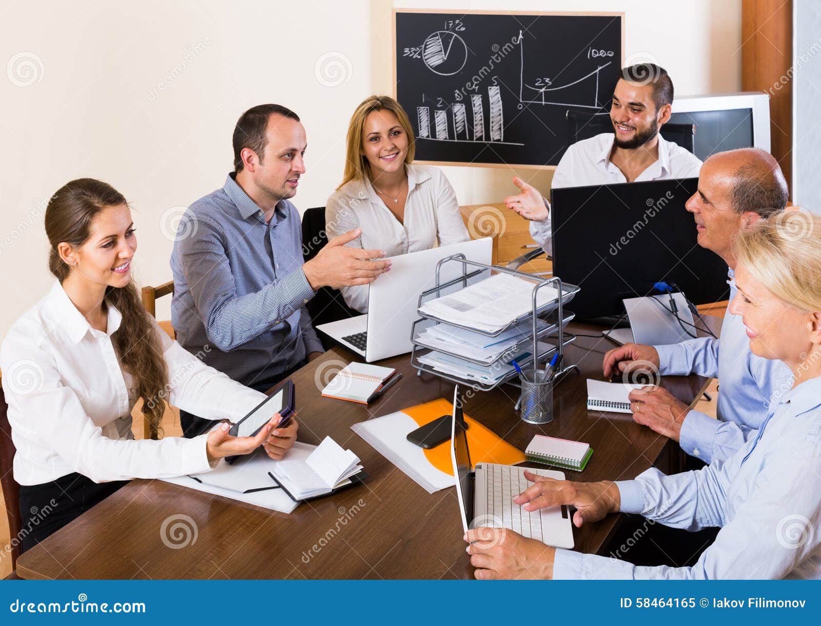 Colleagues Discussing Price Development at Office Stock Image - Image ...