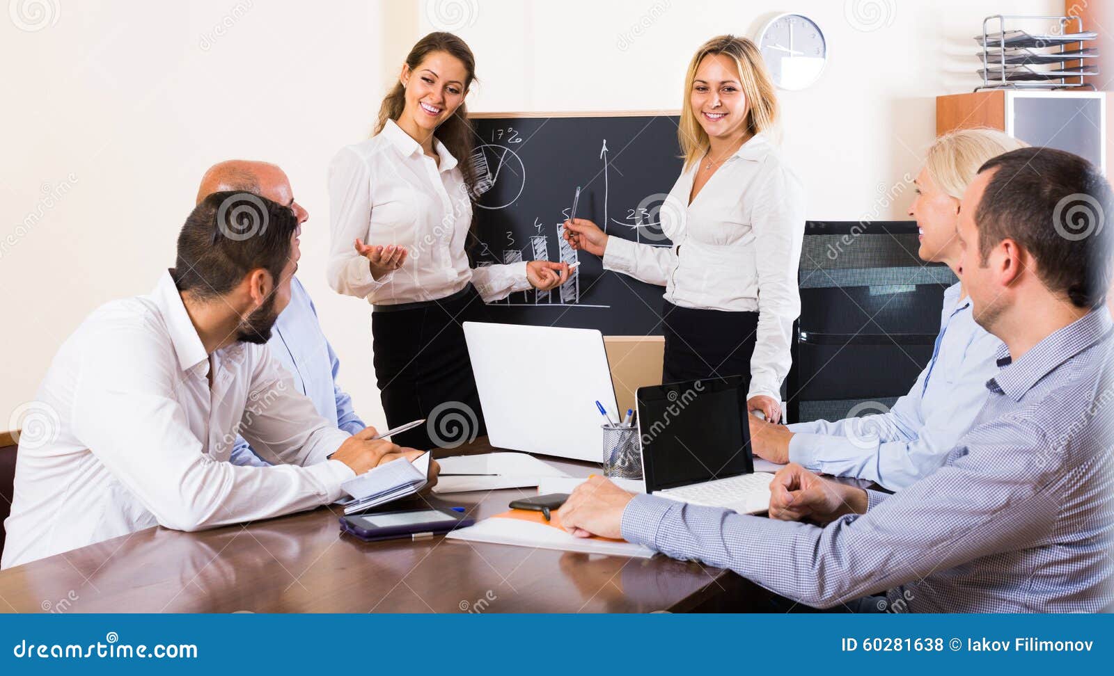 Colleagues Discussing Price Development at Office Stock Photo - Image ...
