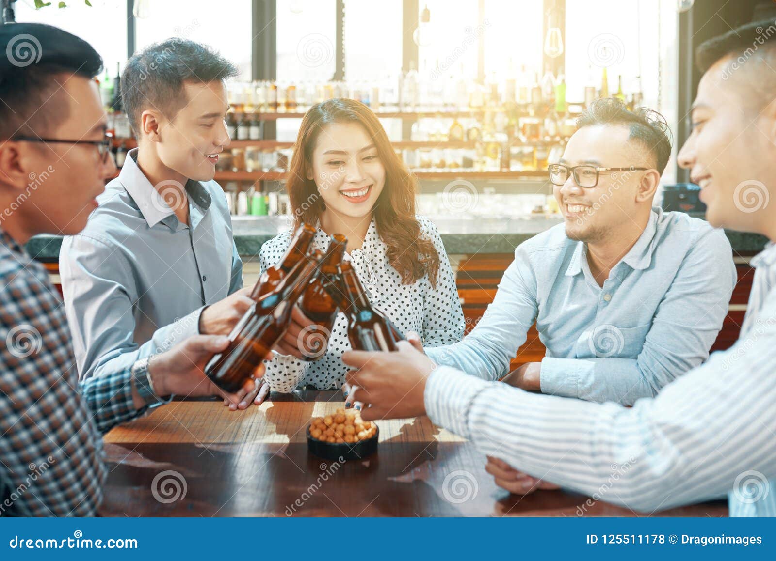 Colleagues drinking beer stock photo. Image of resting - 125511178