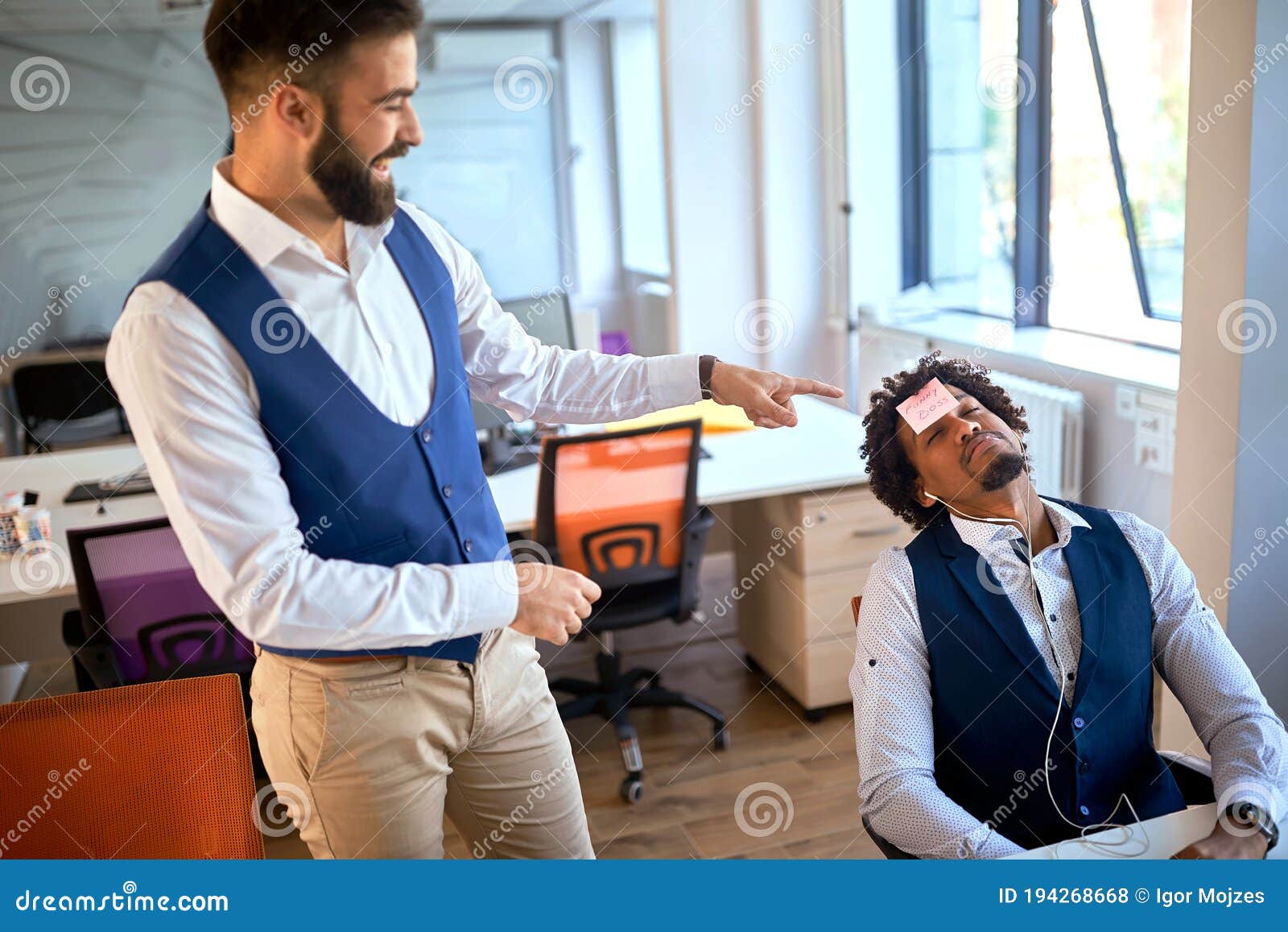 Colleagues Fooling in the Office; Office Prank Concept Stock Photo ...