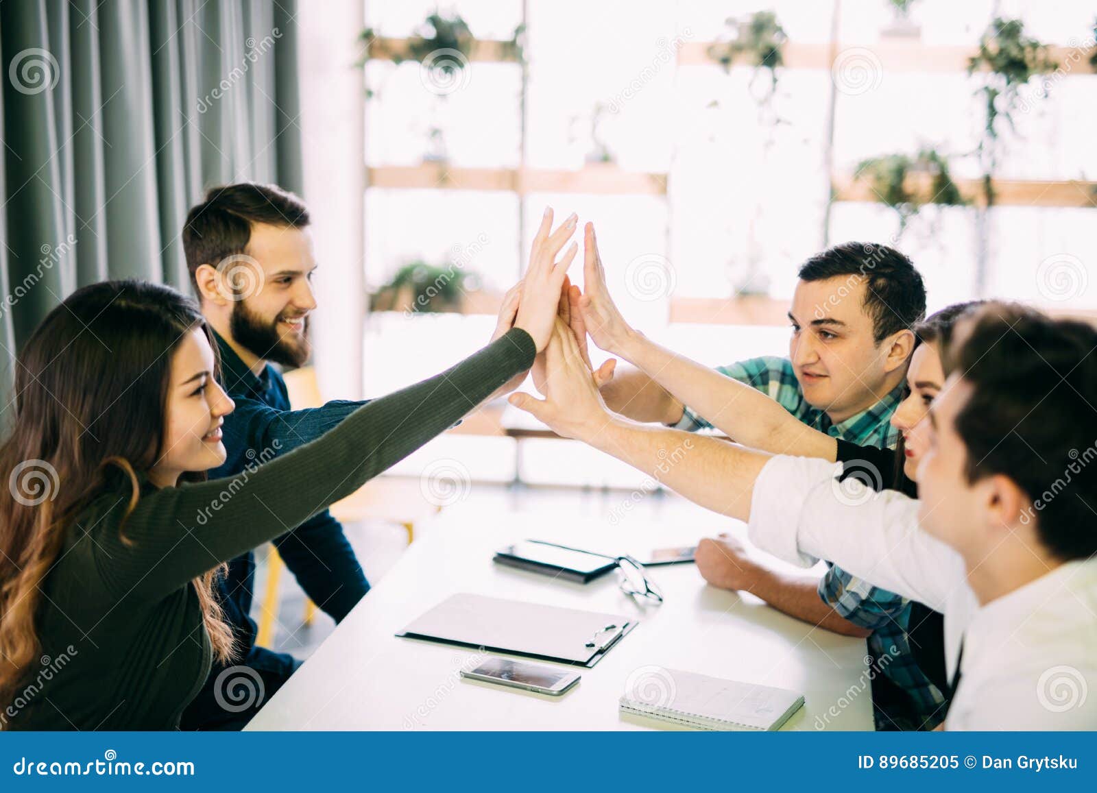 Colleagues Giving High-five in Meeting Room at Creative Office Stock ...