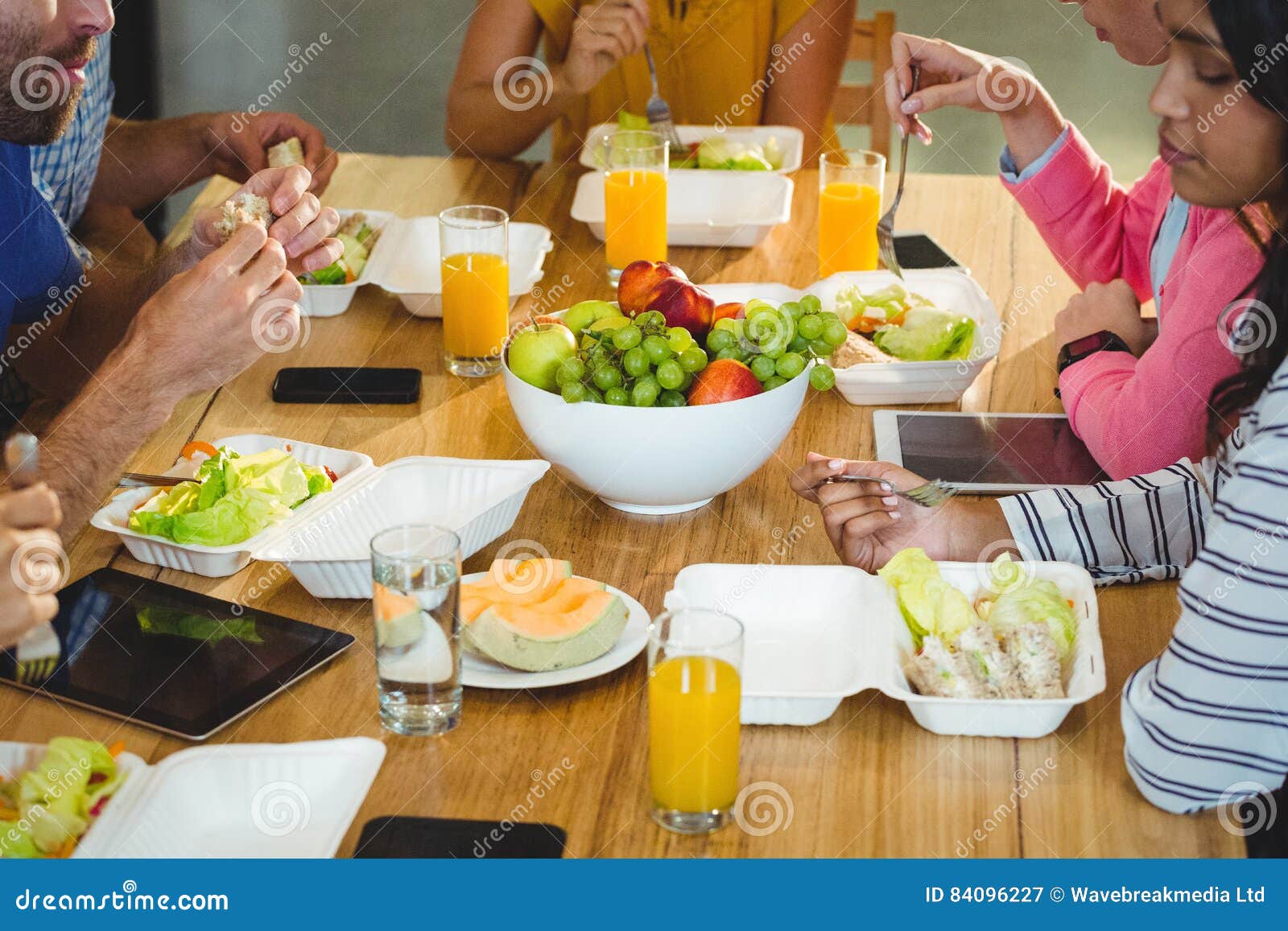 Colleagues Having Breakfast in Office Stock Image - Image of adult ...