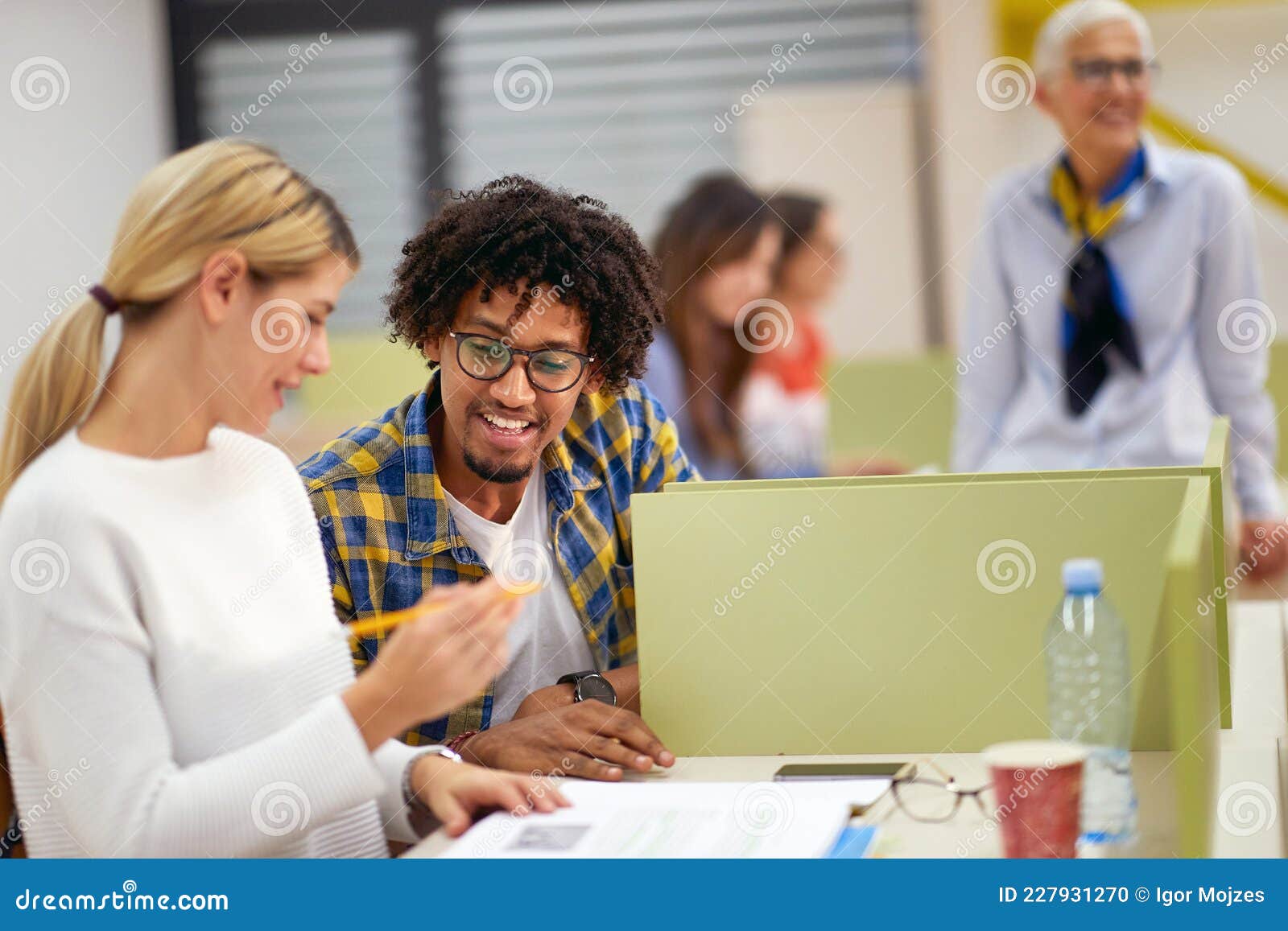 Colleagues Helping Each Other about the Lesson at the Lecture Stock ...