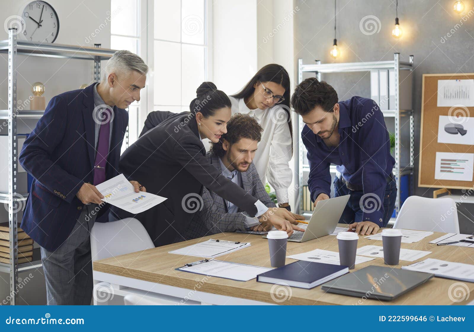 Colleagues Discuss a Business Project by Comparing Analysis Data and ...