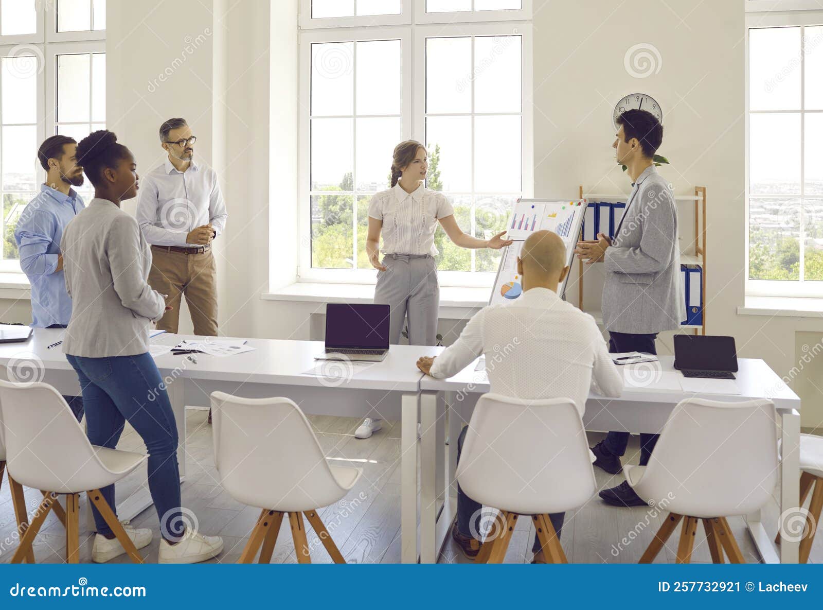 Colleagues in Office Work Discuss Presentation on Whiteboard and ...