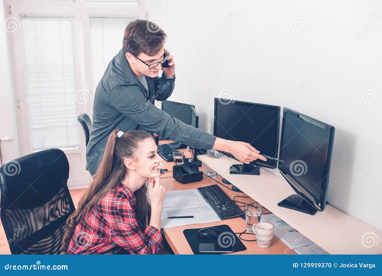 Colleagues in Office Working on Desktop Computer Stock Photo - Image of ...