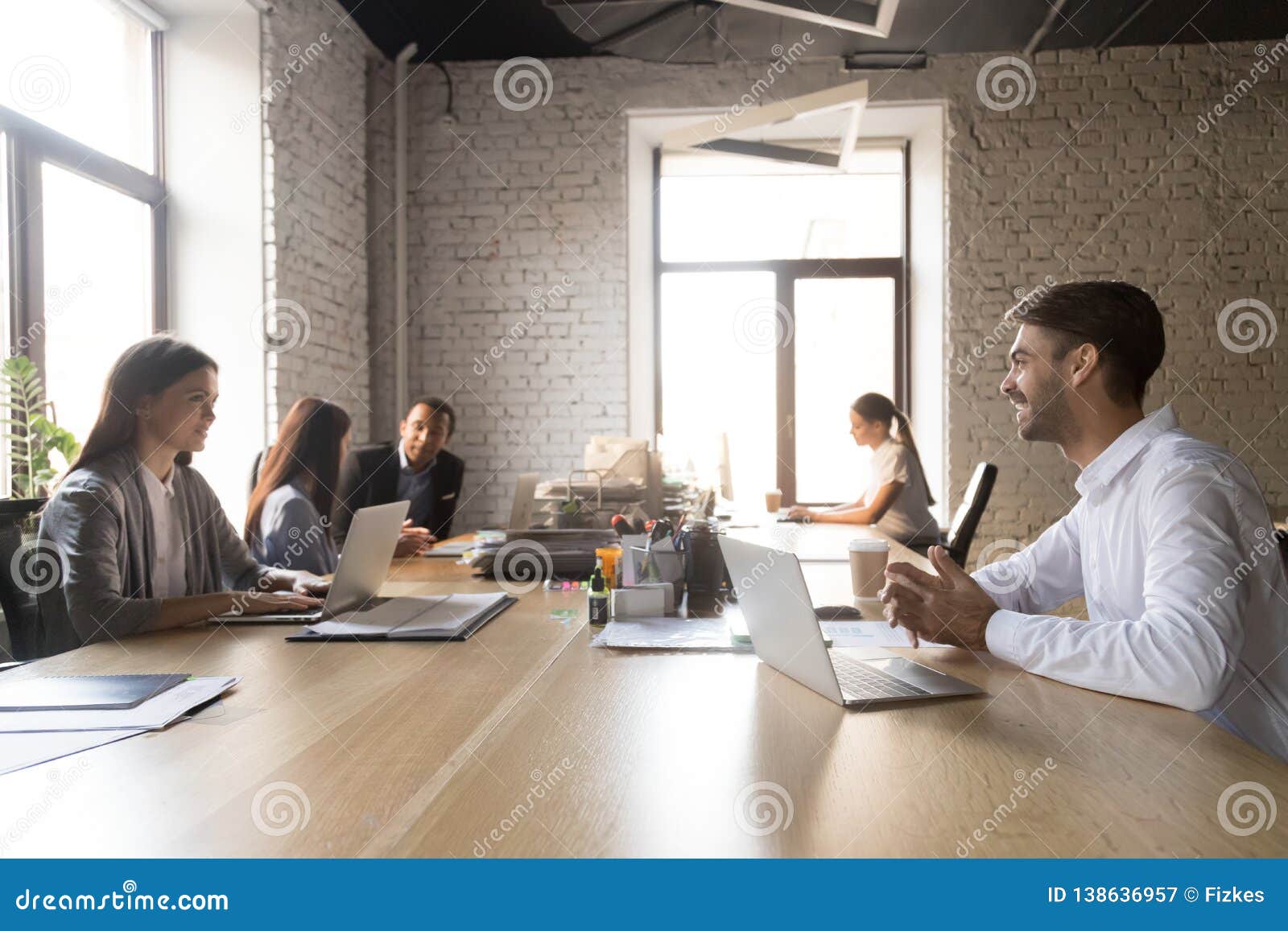 Colleagues Sit at Coworking Table Communicating and Laughing Stock ...